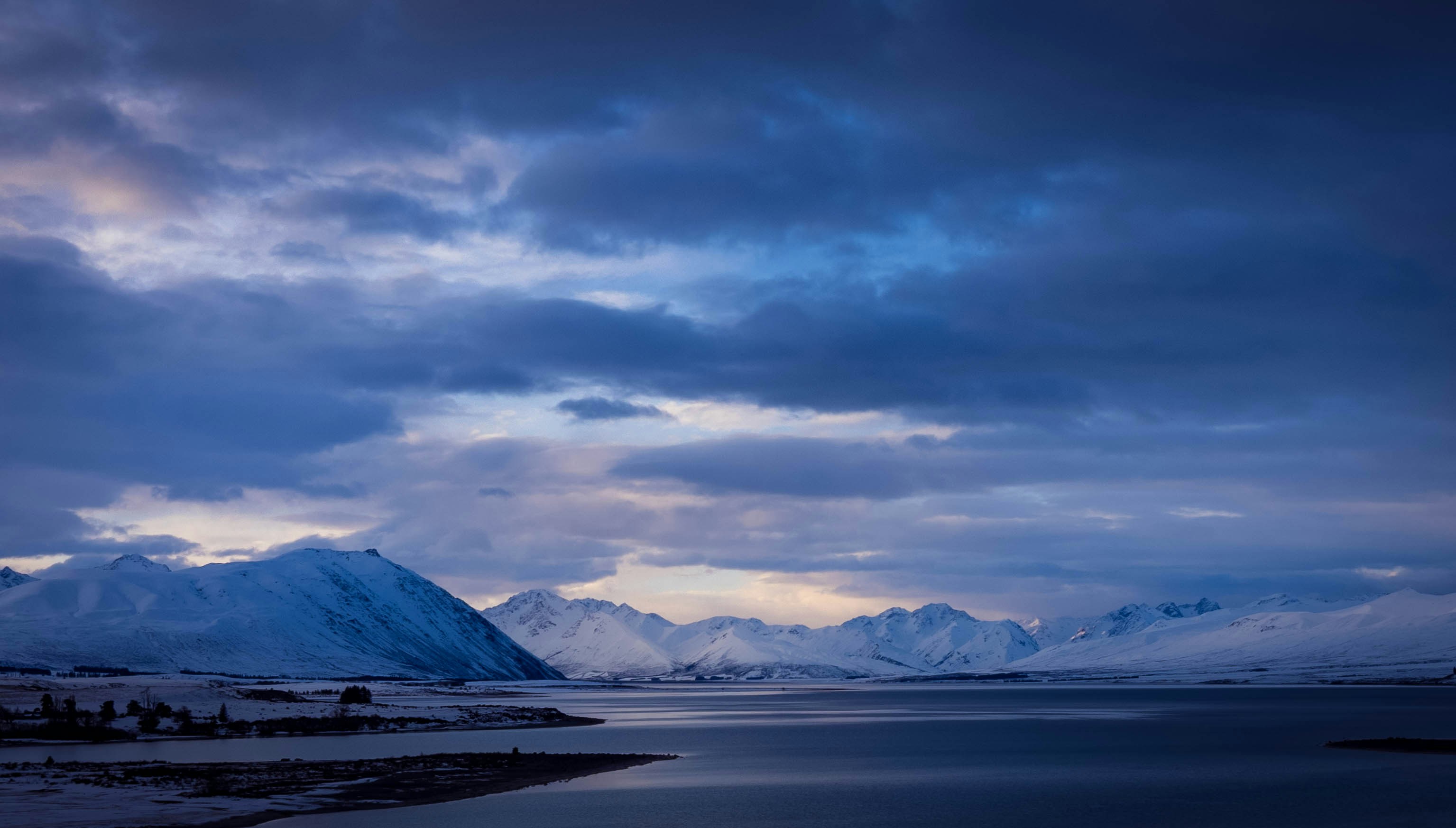 Quiet Fjord at Dusk: Snowy Peaks Meet a Velvet Sea