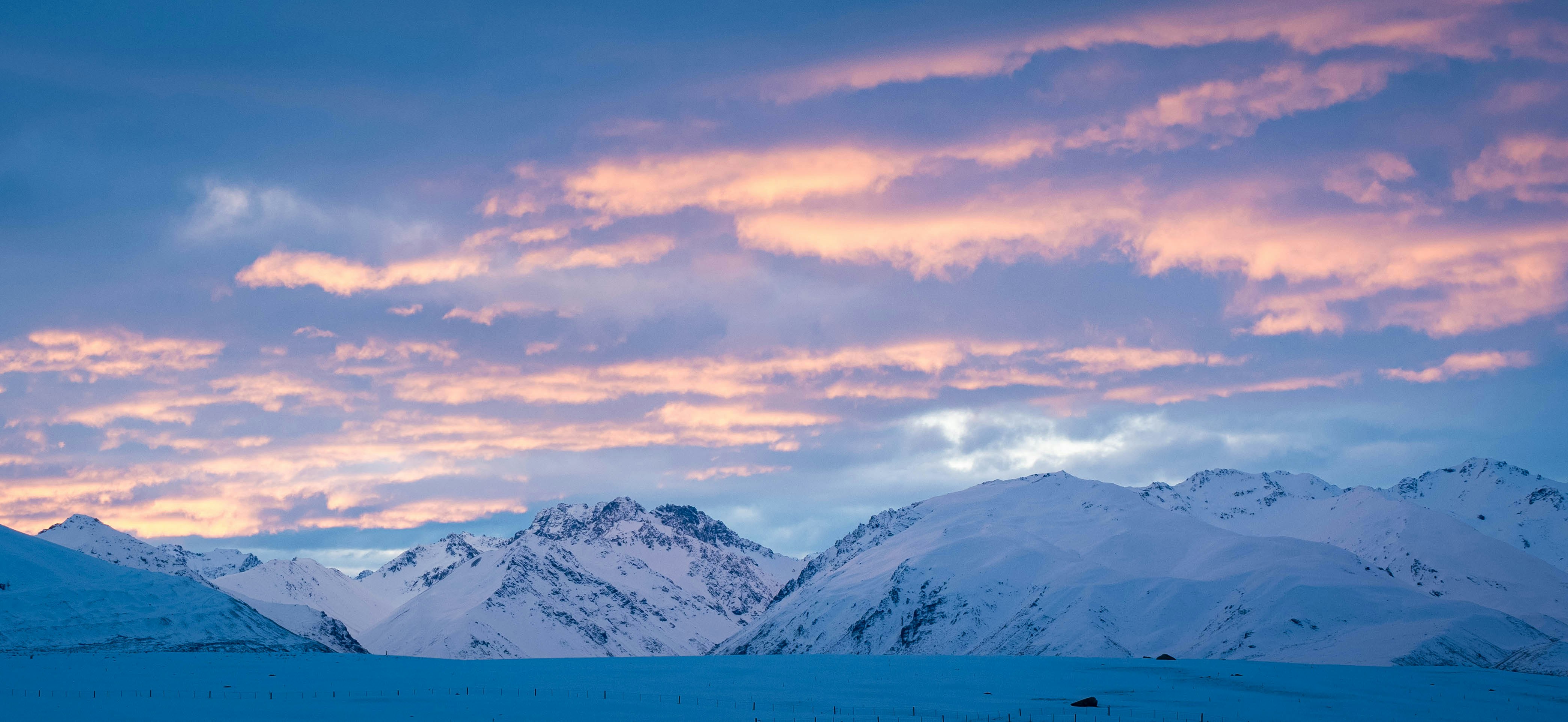 Twilight Slopes Over a Quiet Snowfield