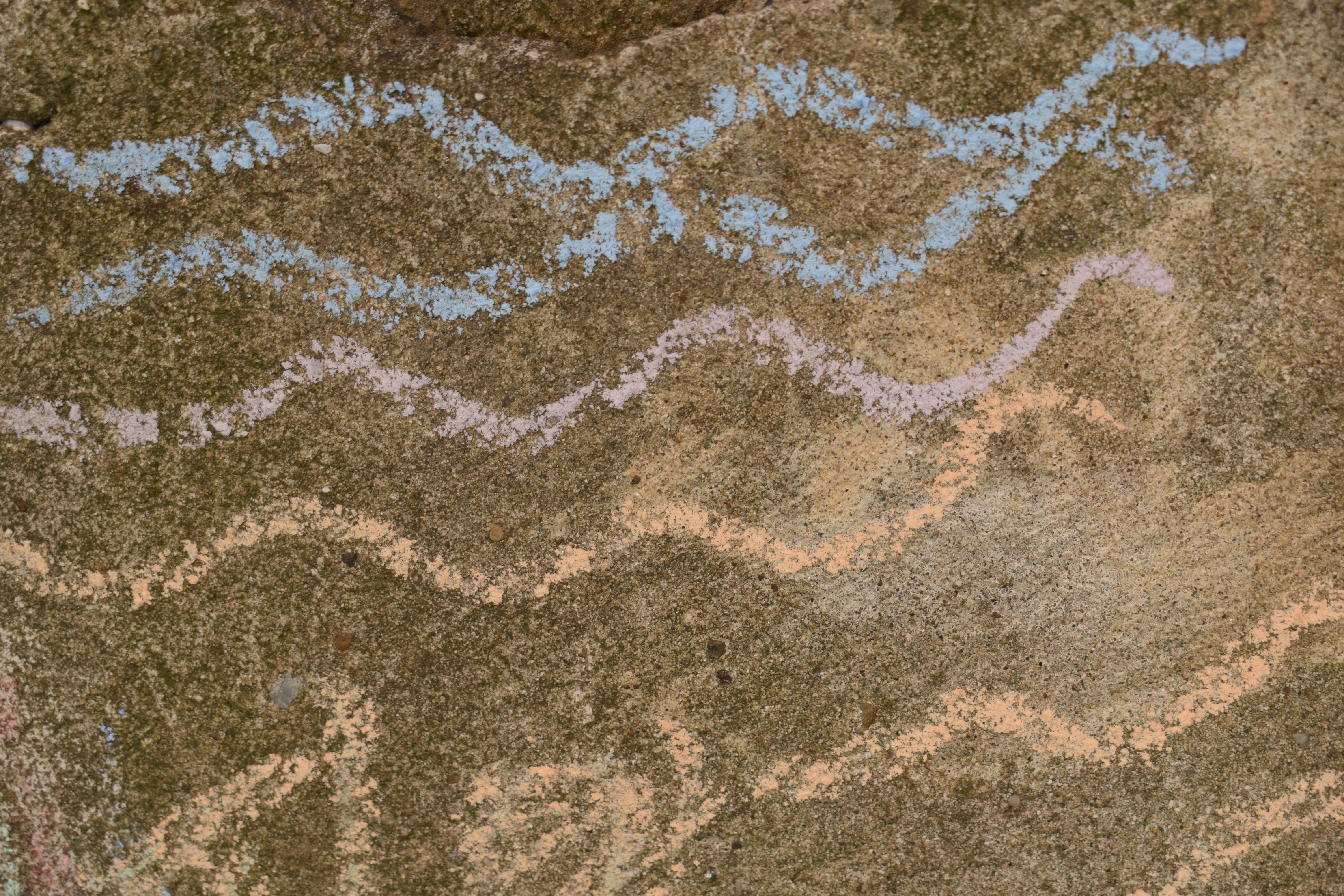 Patched Sandstone: Multi‑Colored Chalk Patterns on a Weathered Surface