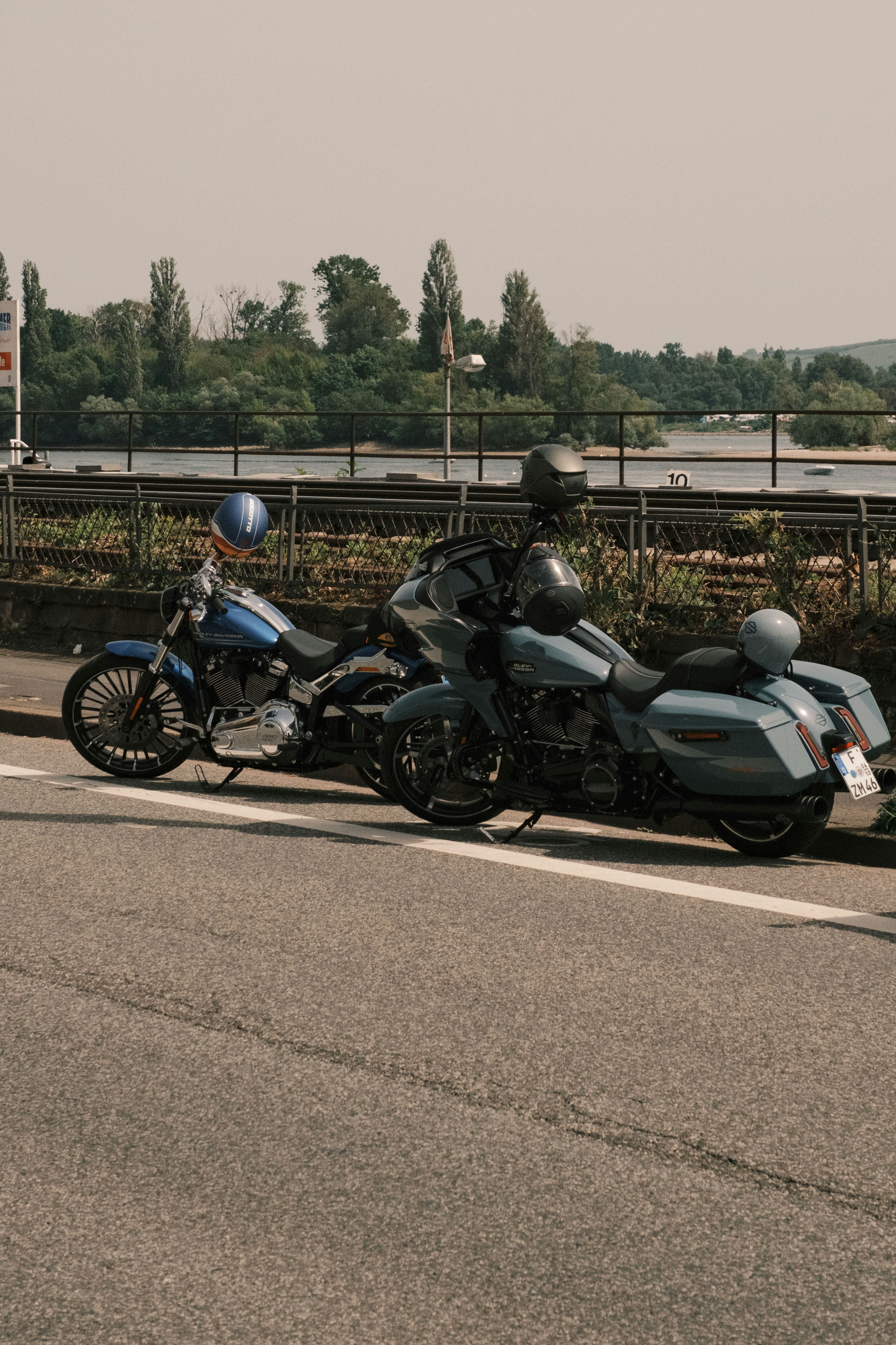 Two Motorcycles Resting by the Waterfront