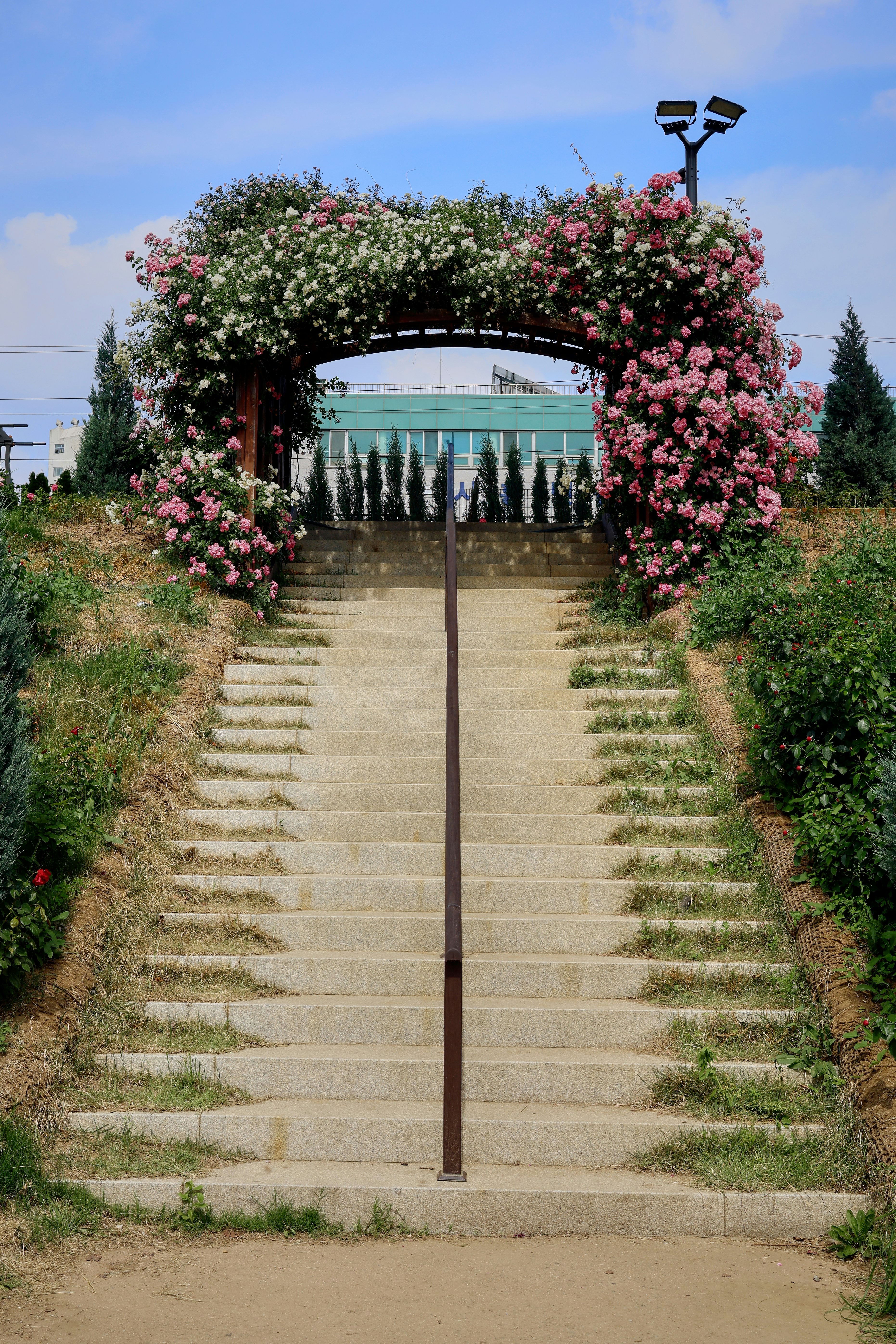 Floral Arch Gateway Over a Central Staircase