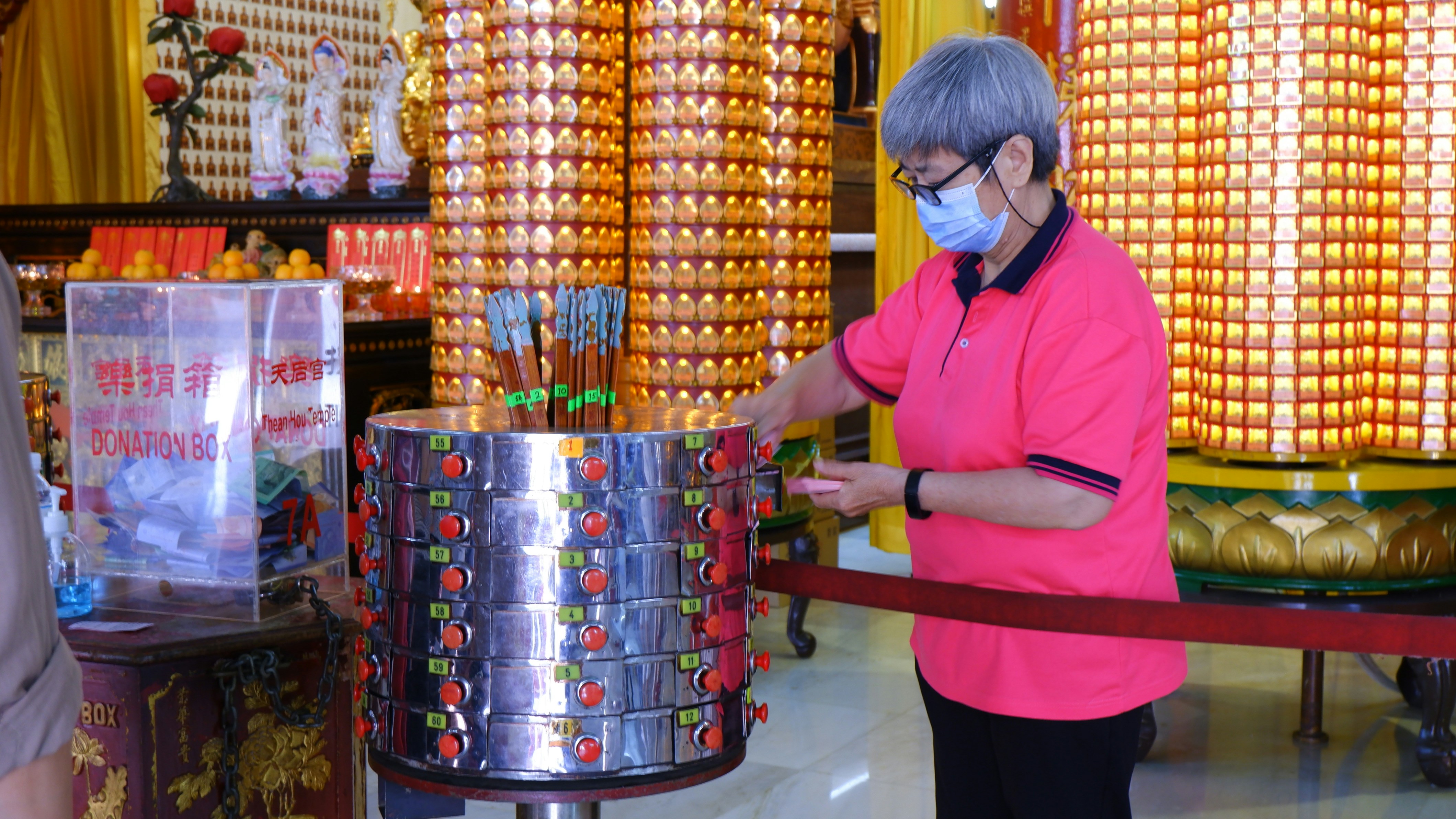 Temple Visitor at a Shrine Reservation Wheel