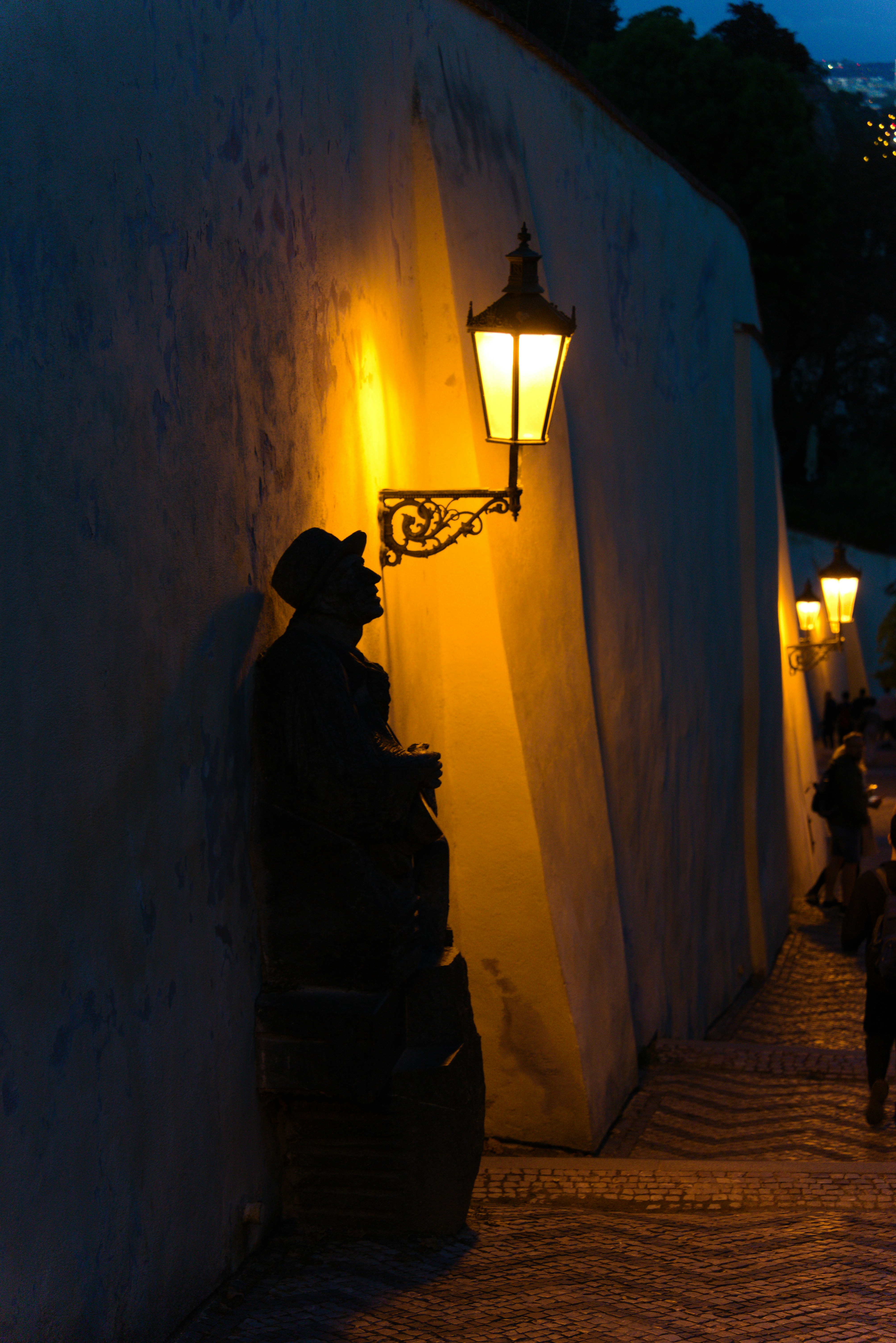 Warm Lanterns along a Narrow Cobblestone Lane