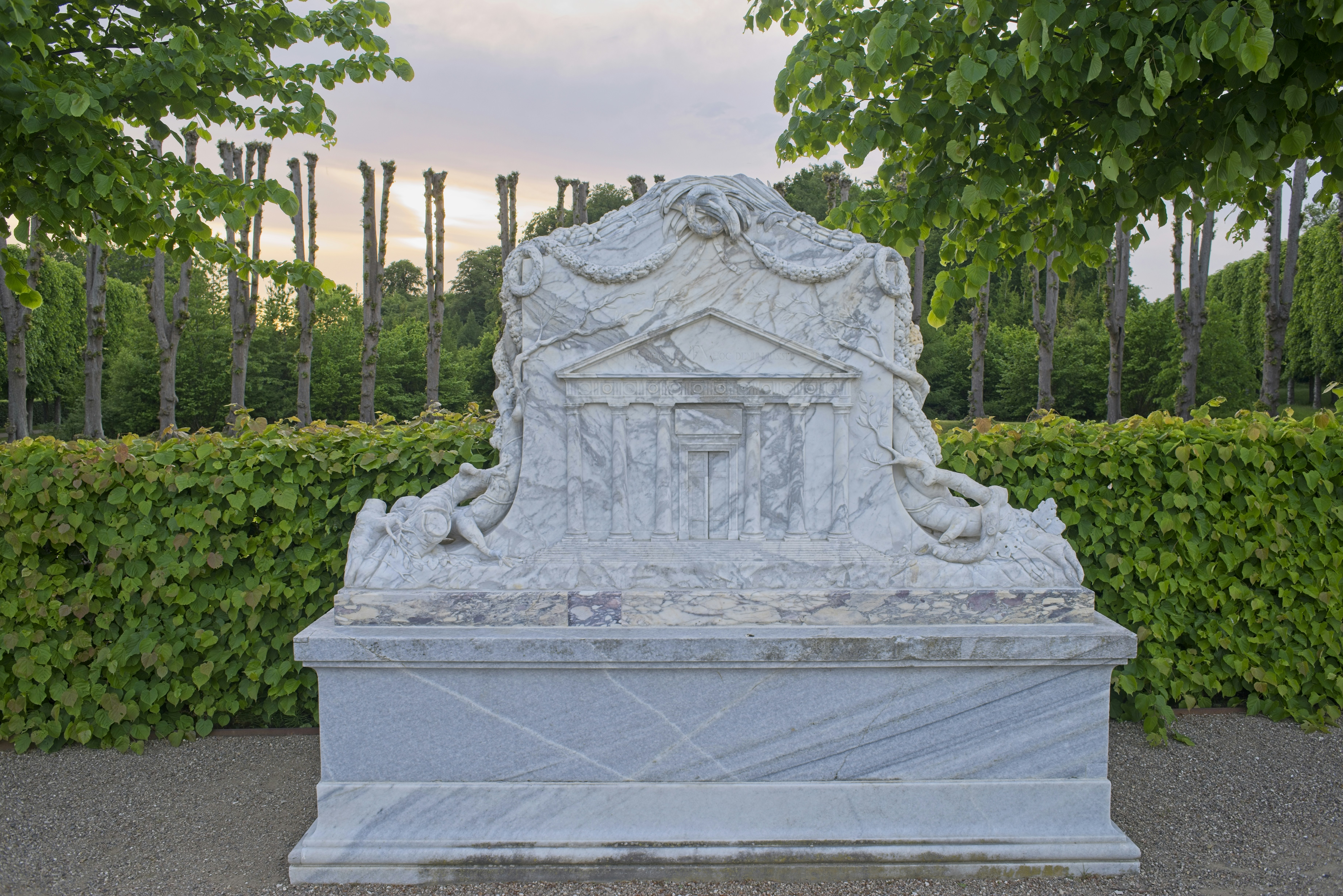 Serene Marble Relief in a Quiet Garden