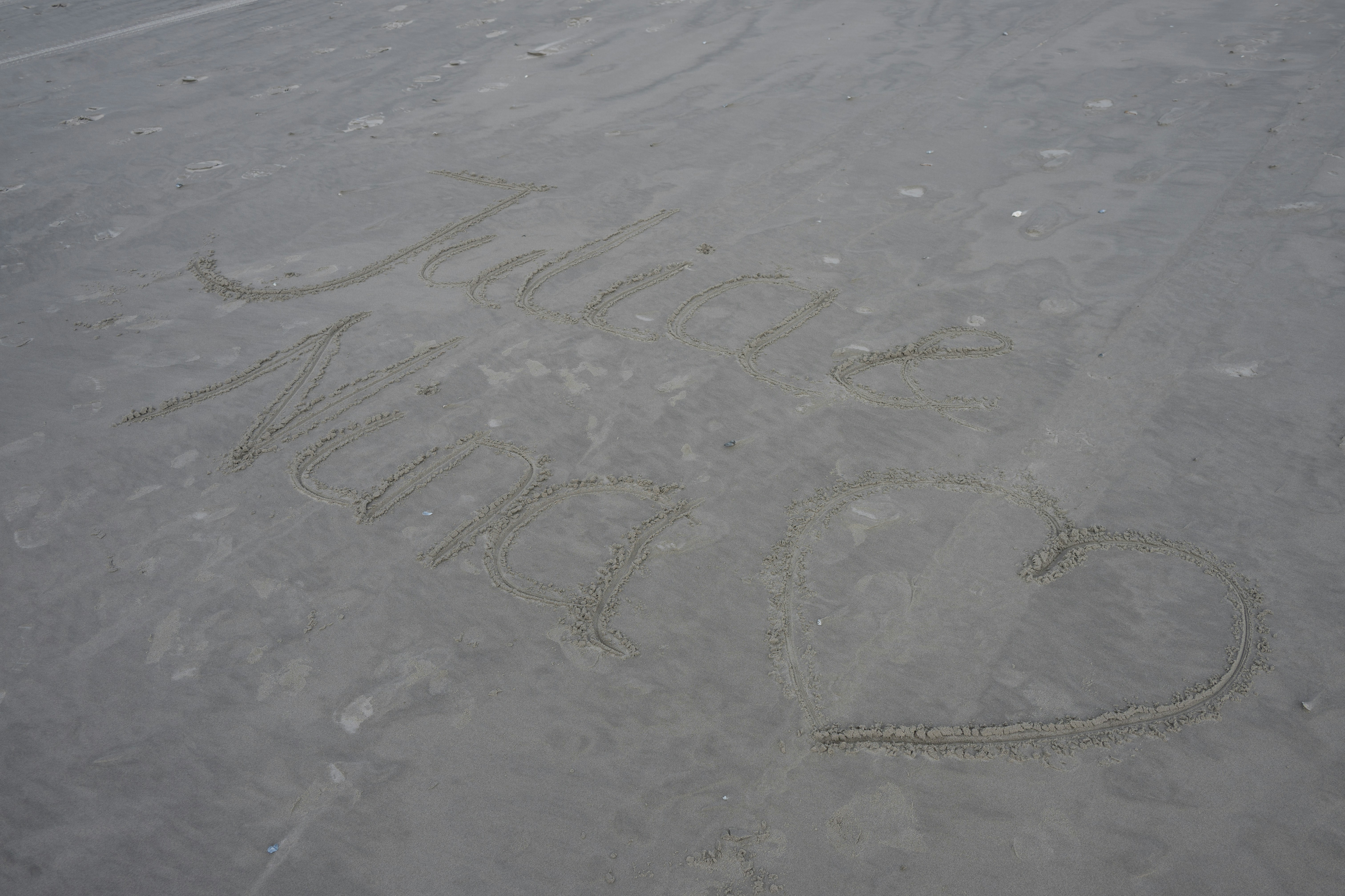 Heartfelt Message in the Wet Sand