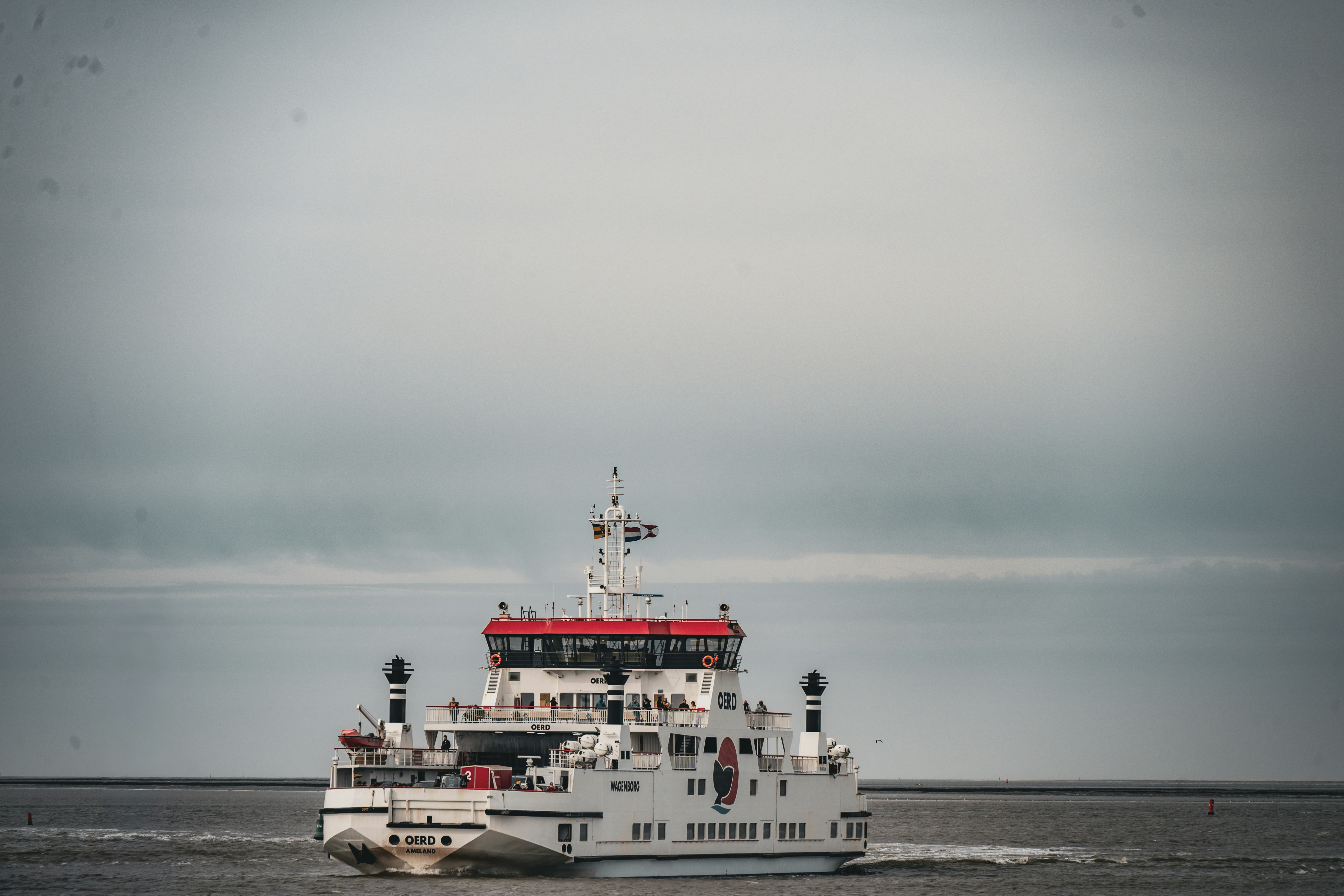 Horizon-Ferry Crossing: A White Vessel on Quiet Open Seas