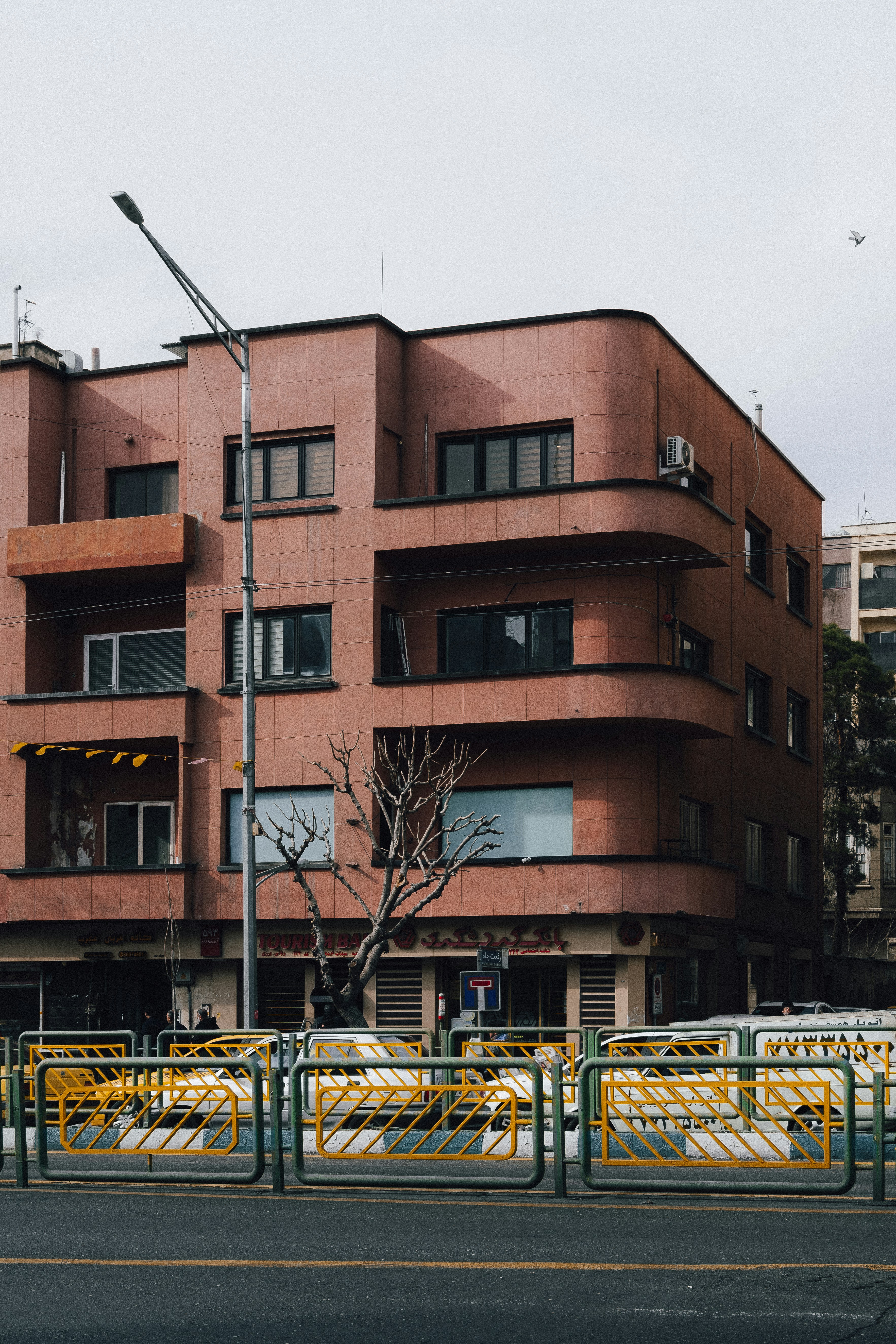 Urban Red Brick: A Quiet Moment Amid Barriers