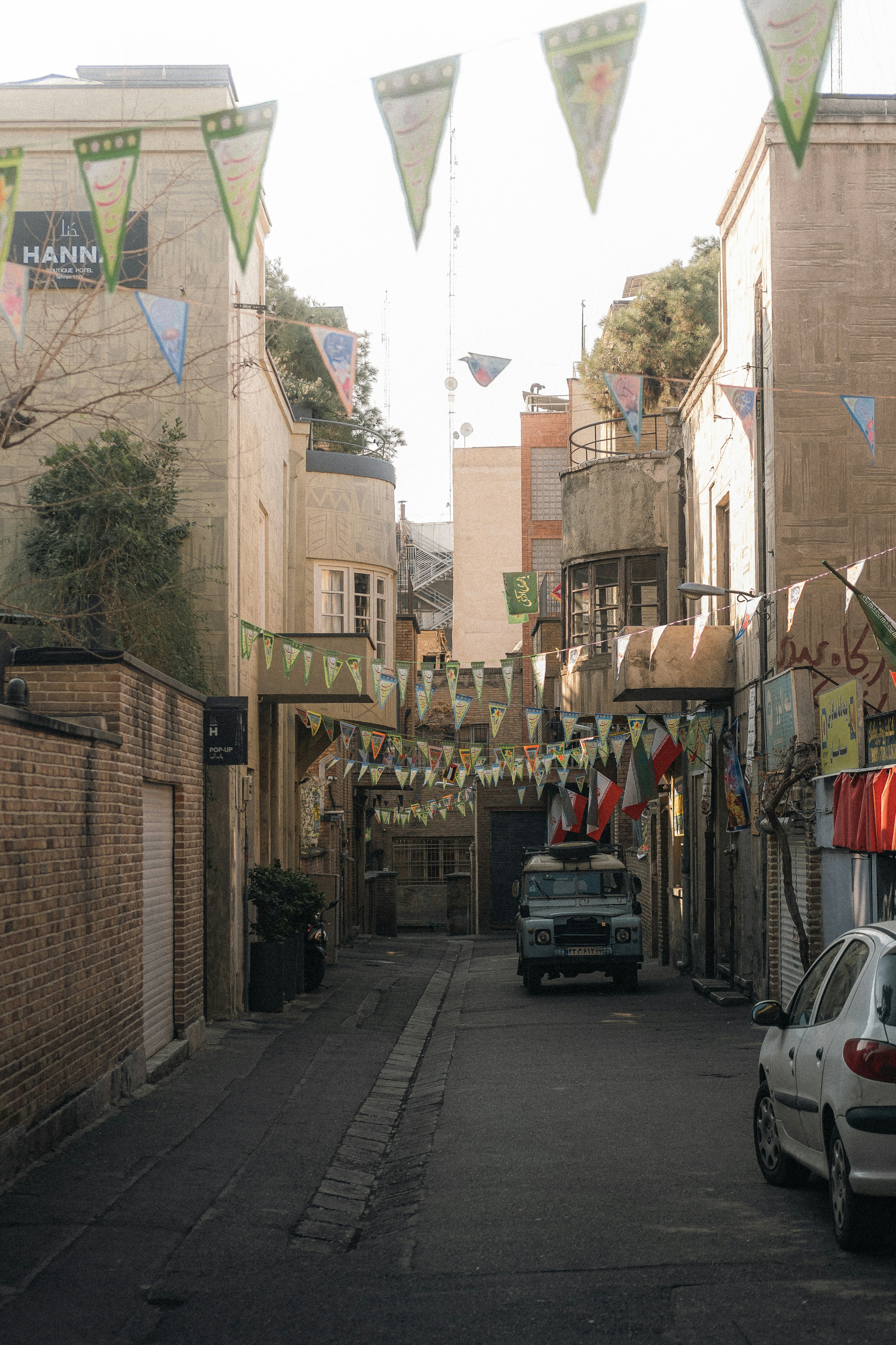 Colorful Street Festival Awnings Over a Quiet Lane