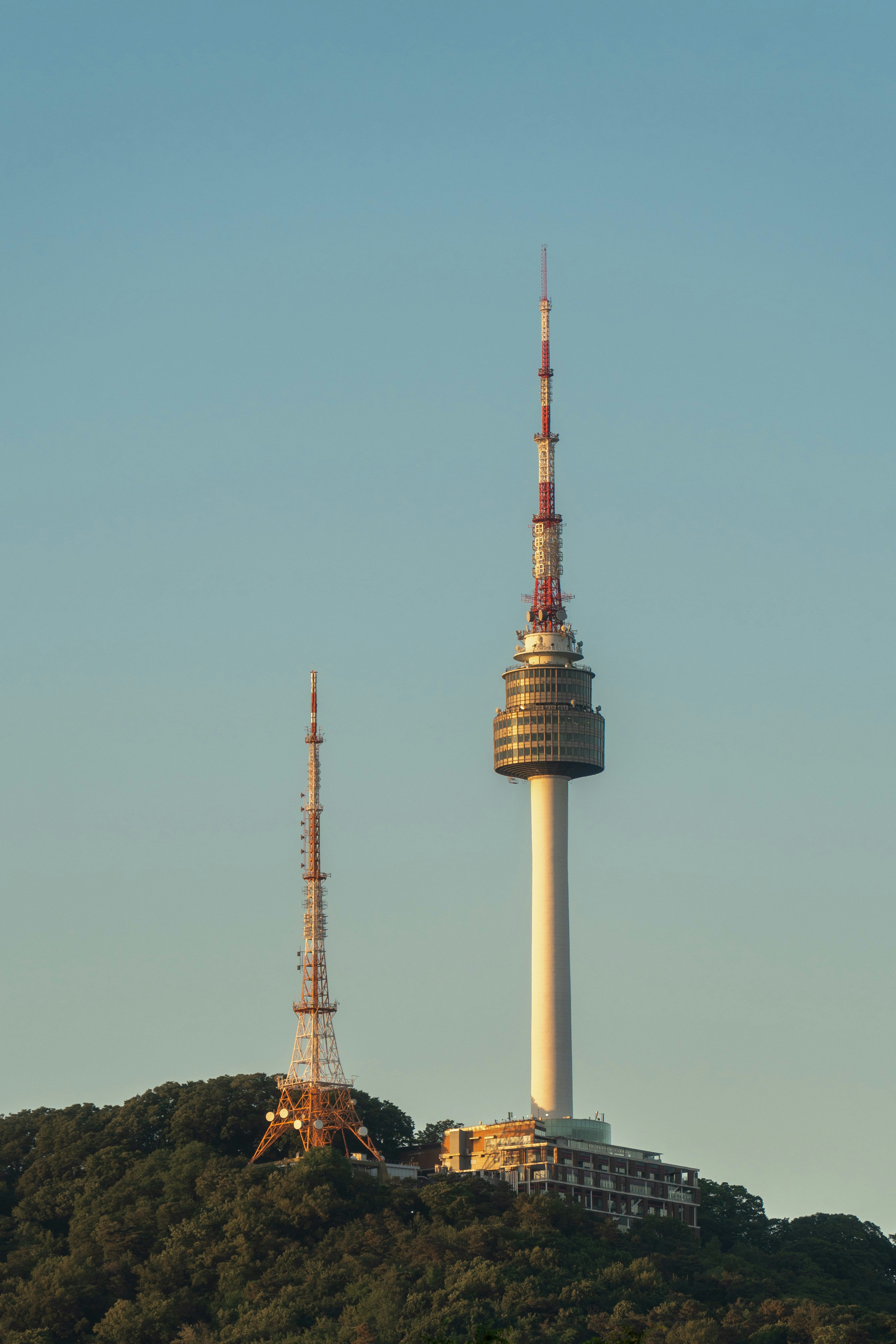 City Tower Silhouette: Aerial Antenna Crown Against Evening Sky