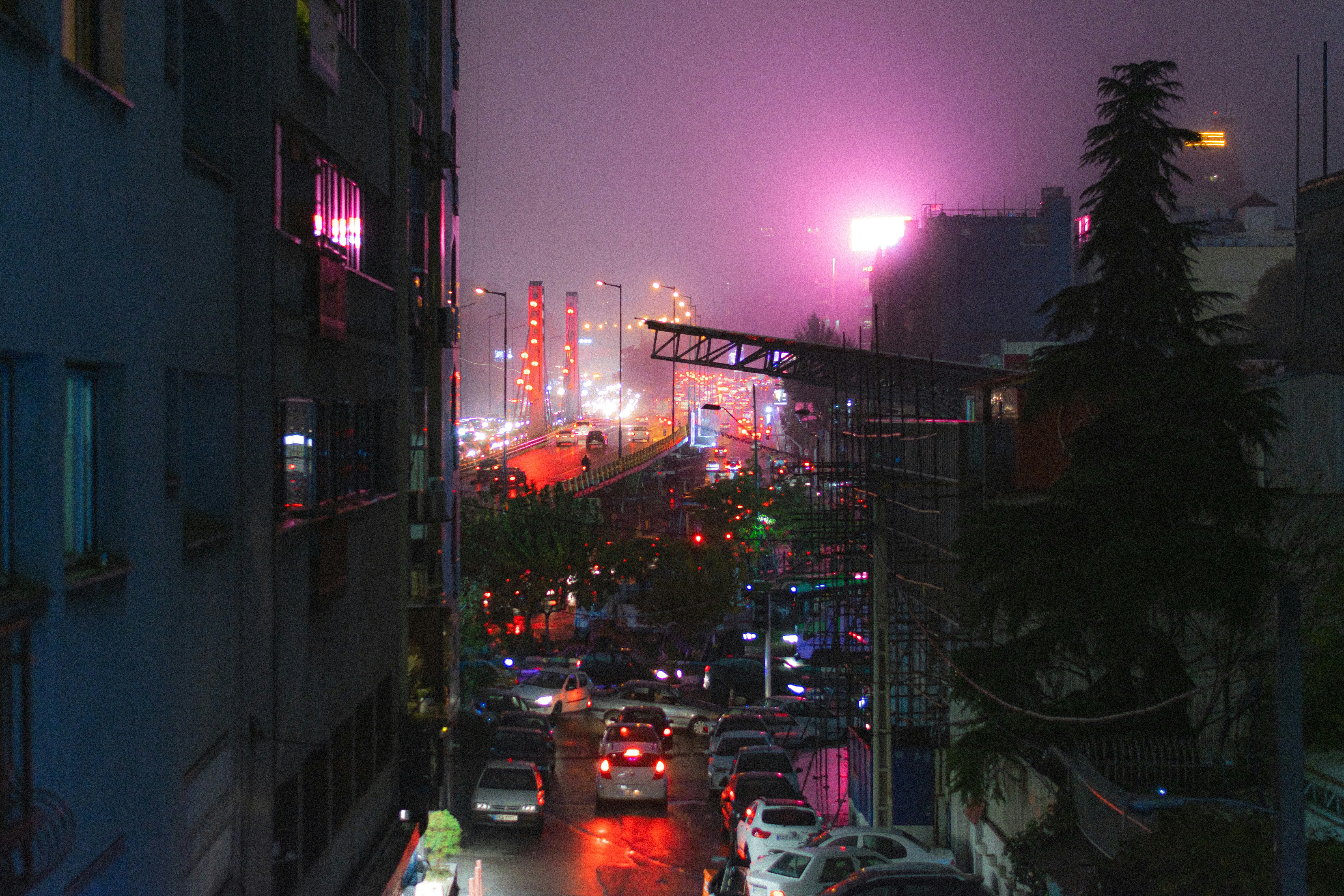 Neon River: Downtown Nightfall in Neon-Coated Rain