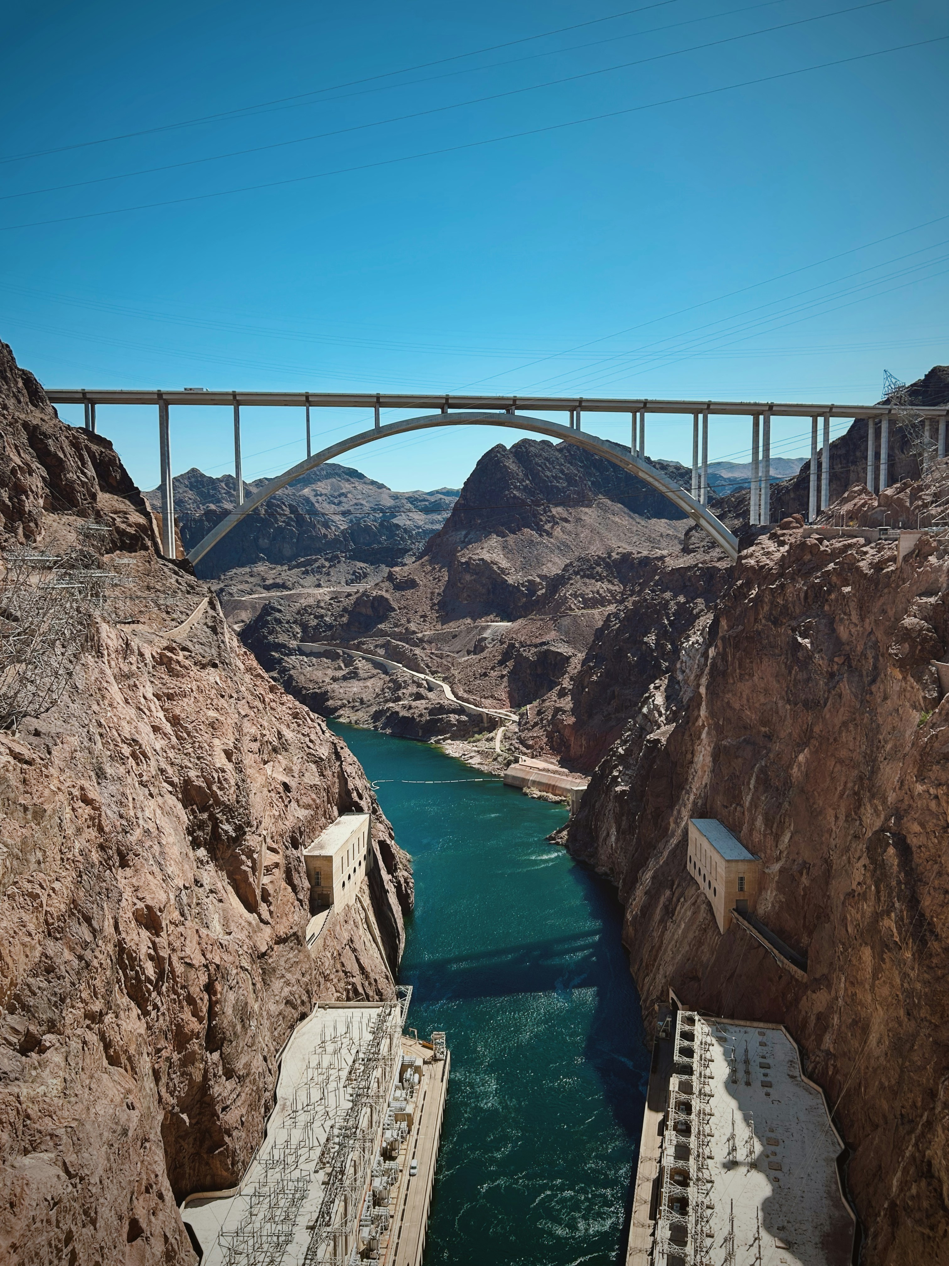 Viaduct Over the Gorge: A Sunlit Rift Framed by Weathered Rocks