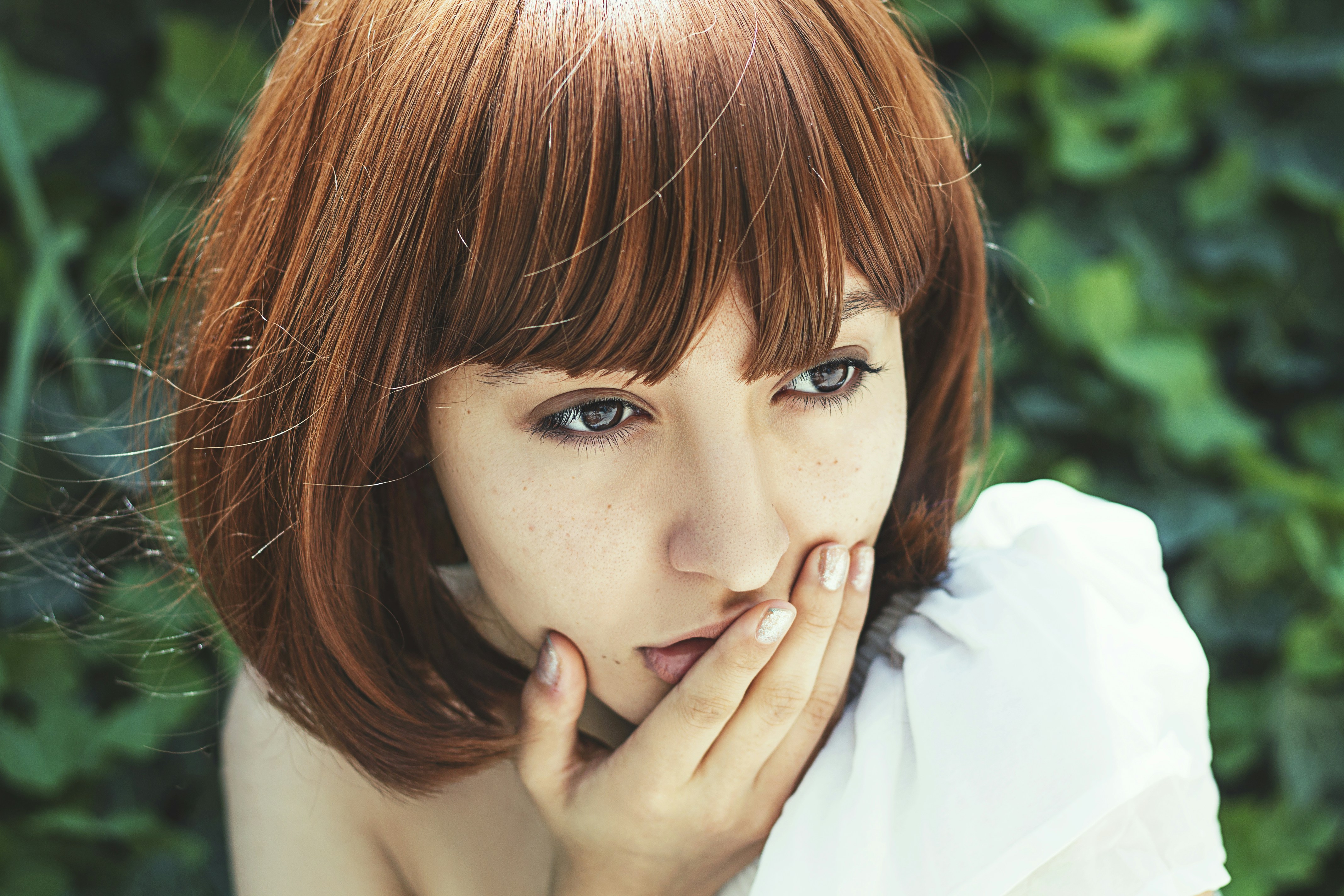 Veiled Gaze Beneath Auburn Tresses