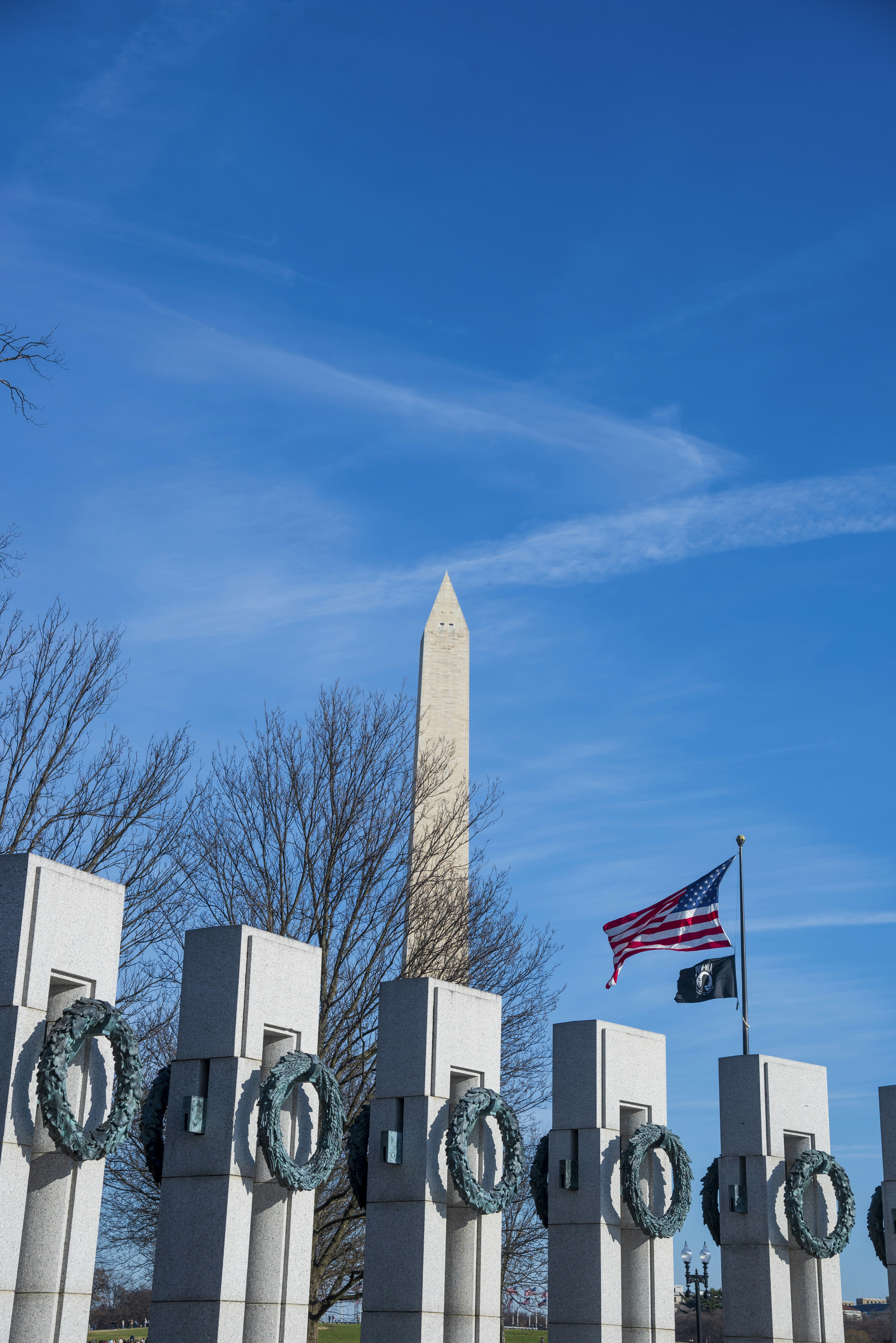Washington Monument Silhouette Over Memorial Arches