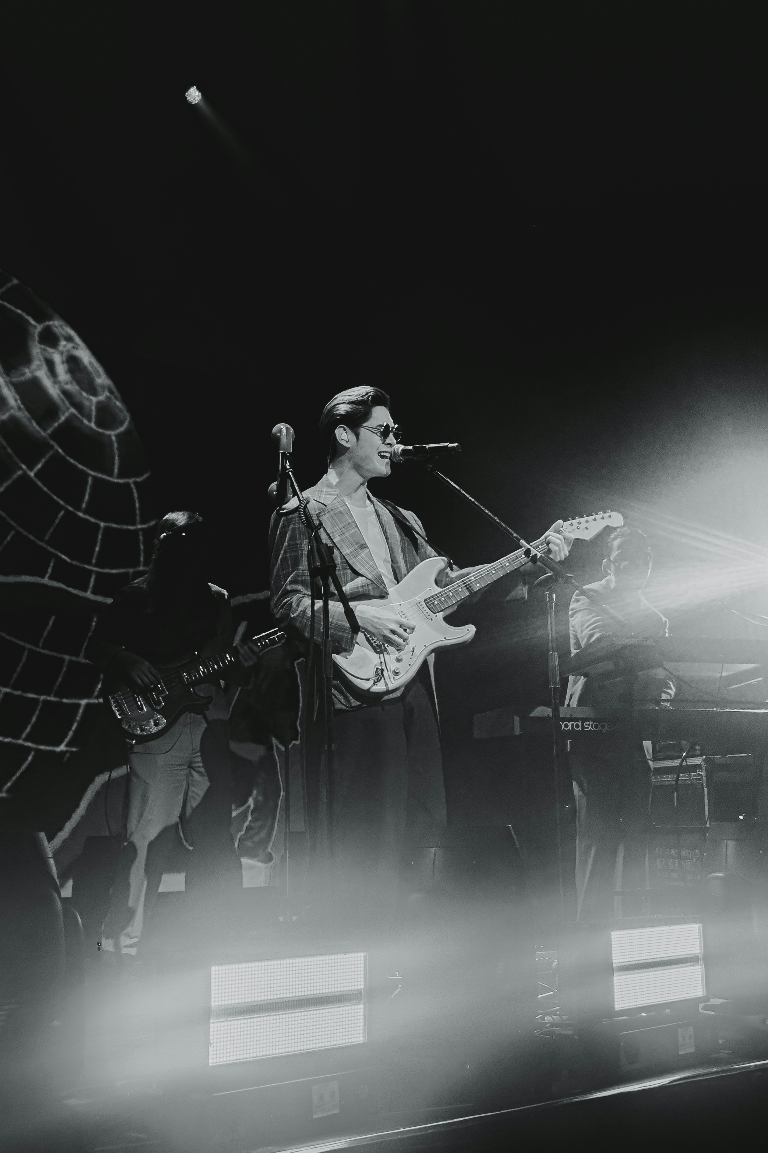 Midnight Reverie: A guitarist under stage glow