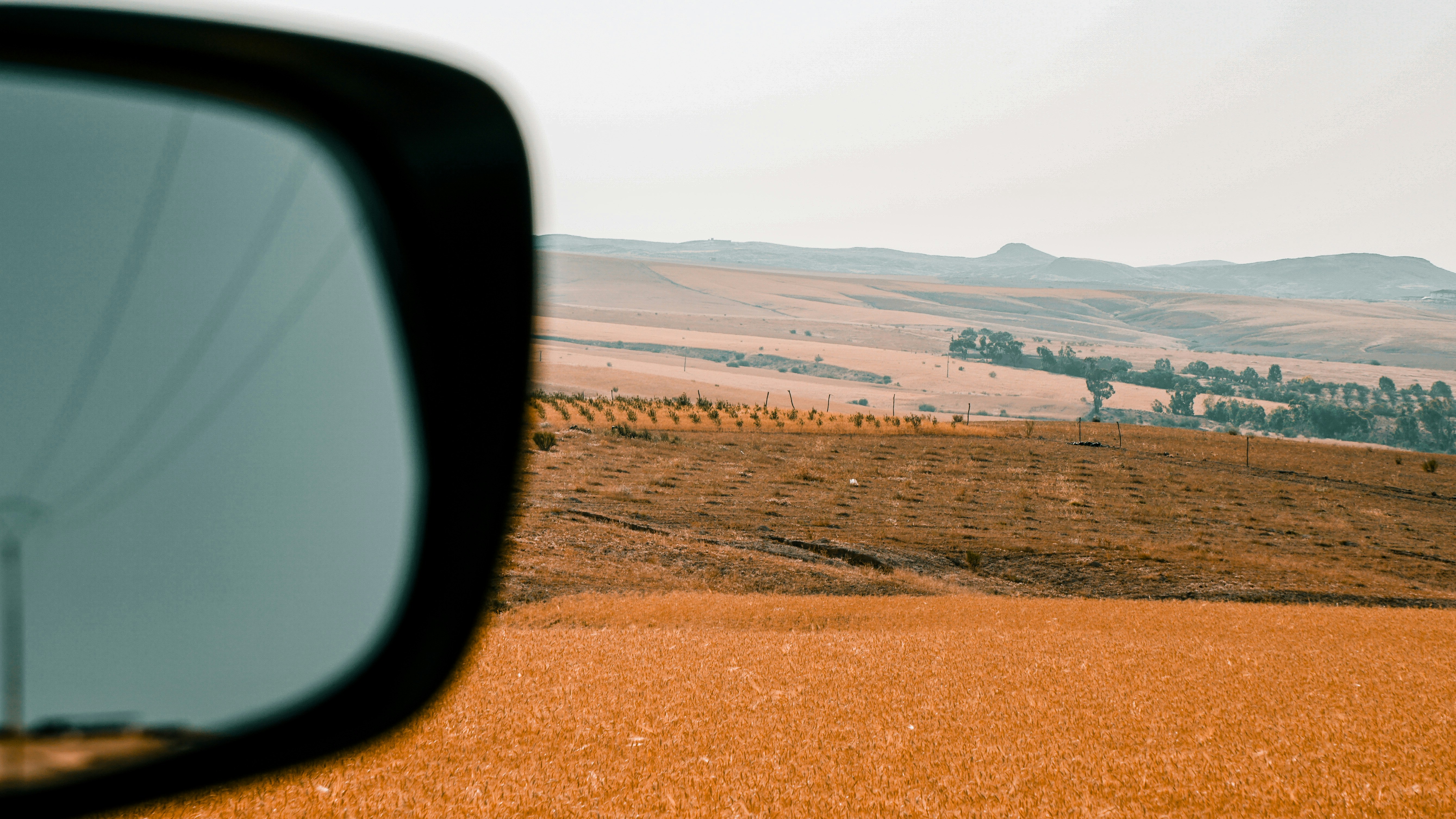 Desert Horizon Reflected in a Car Mirror