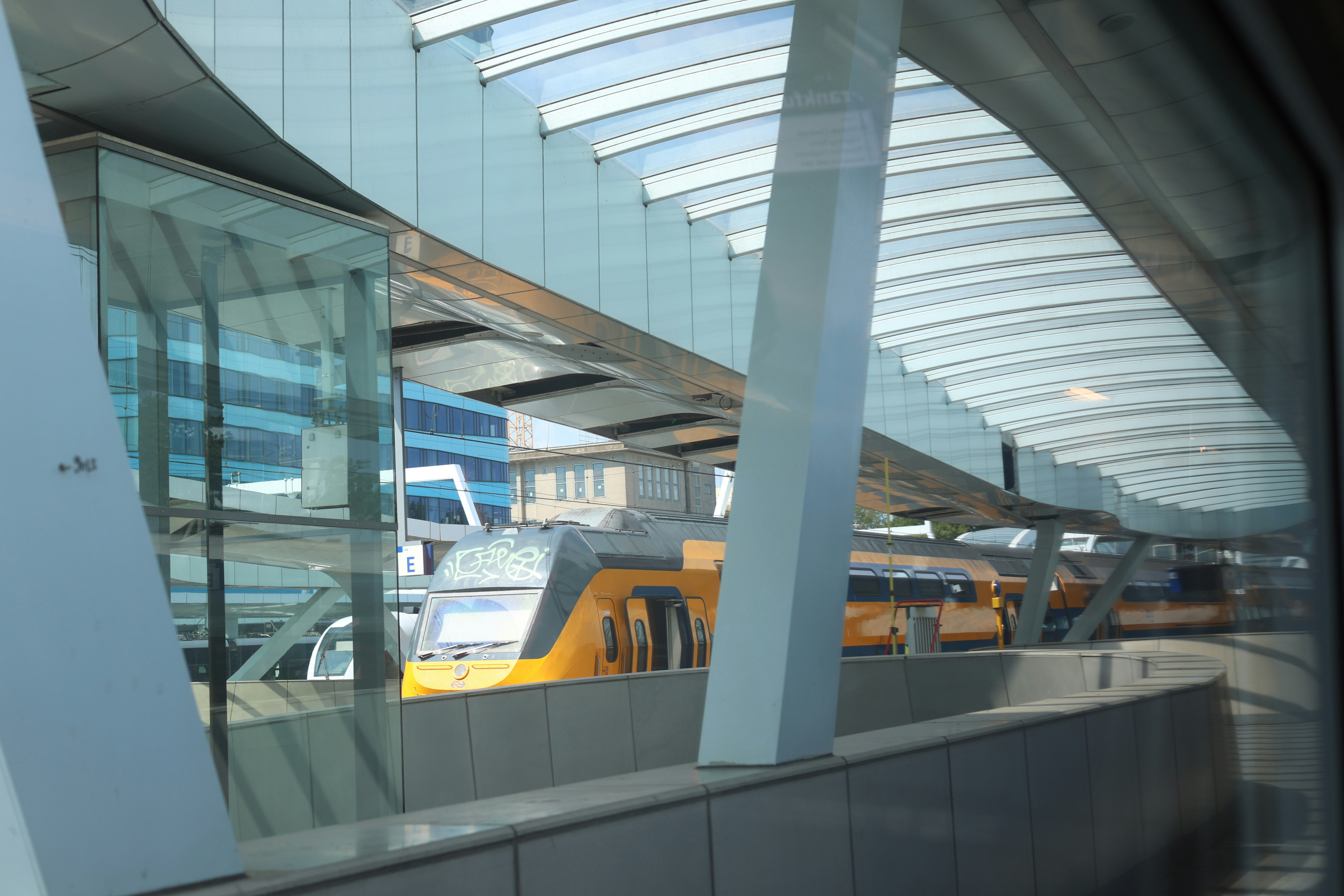 Gliding Through Glass: Trains at the Translucent Platform