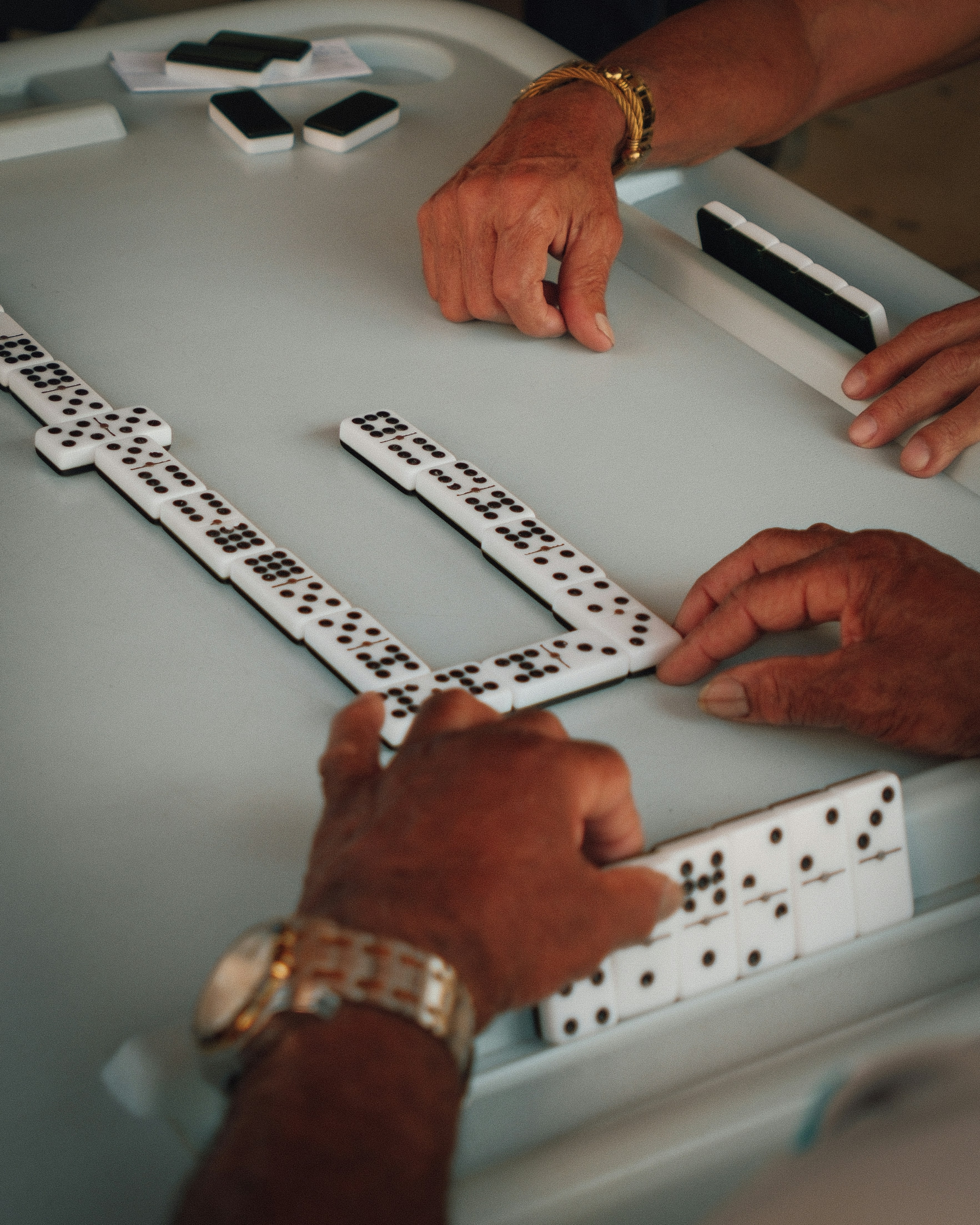 Domino Surge: Hands, Cards, and a Timed Domino Line.