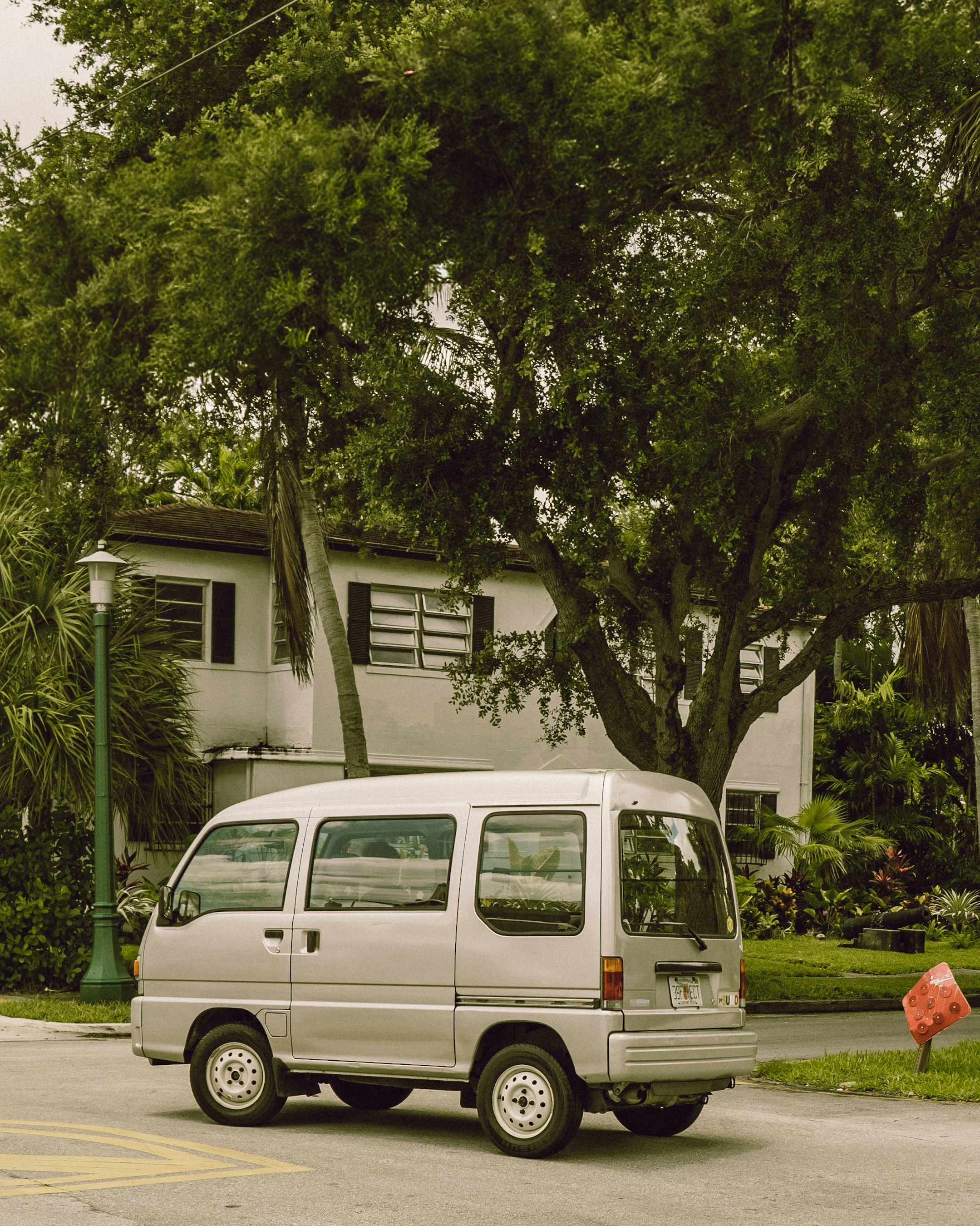Silver Van at a Quiet Suburban Corner