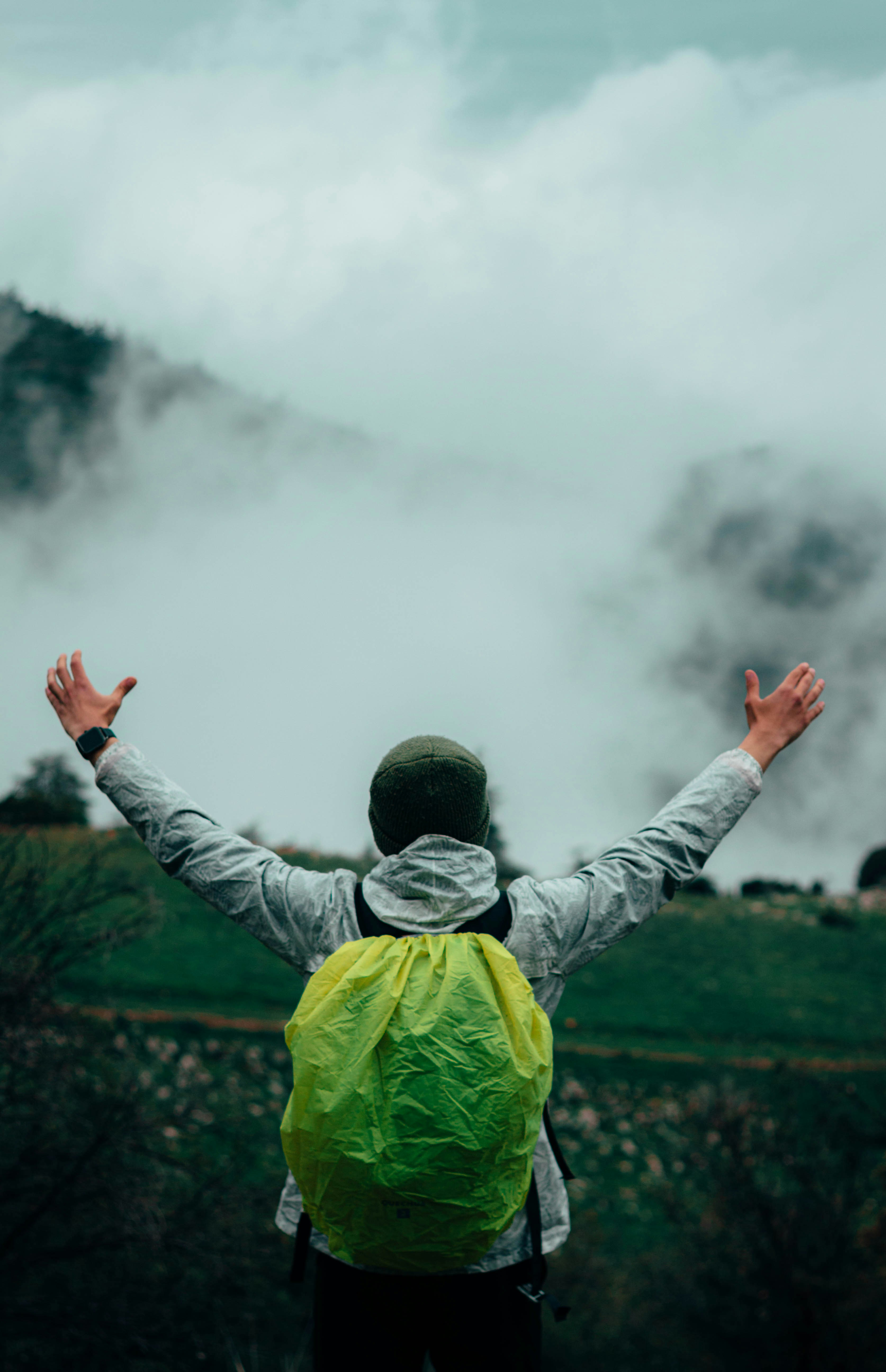 Embrace of the Mist: A Backpacker Faces the Clouded Horizon