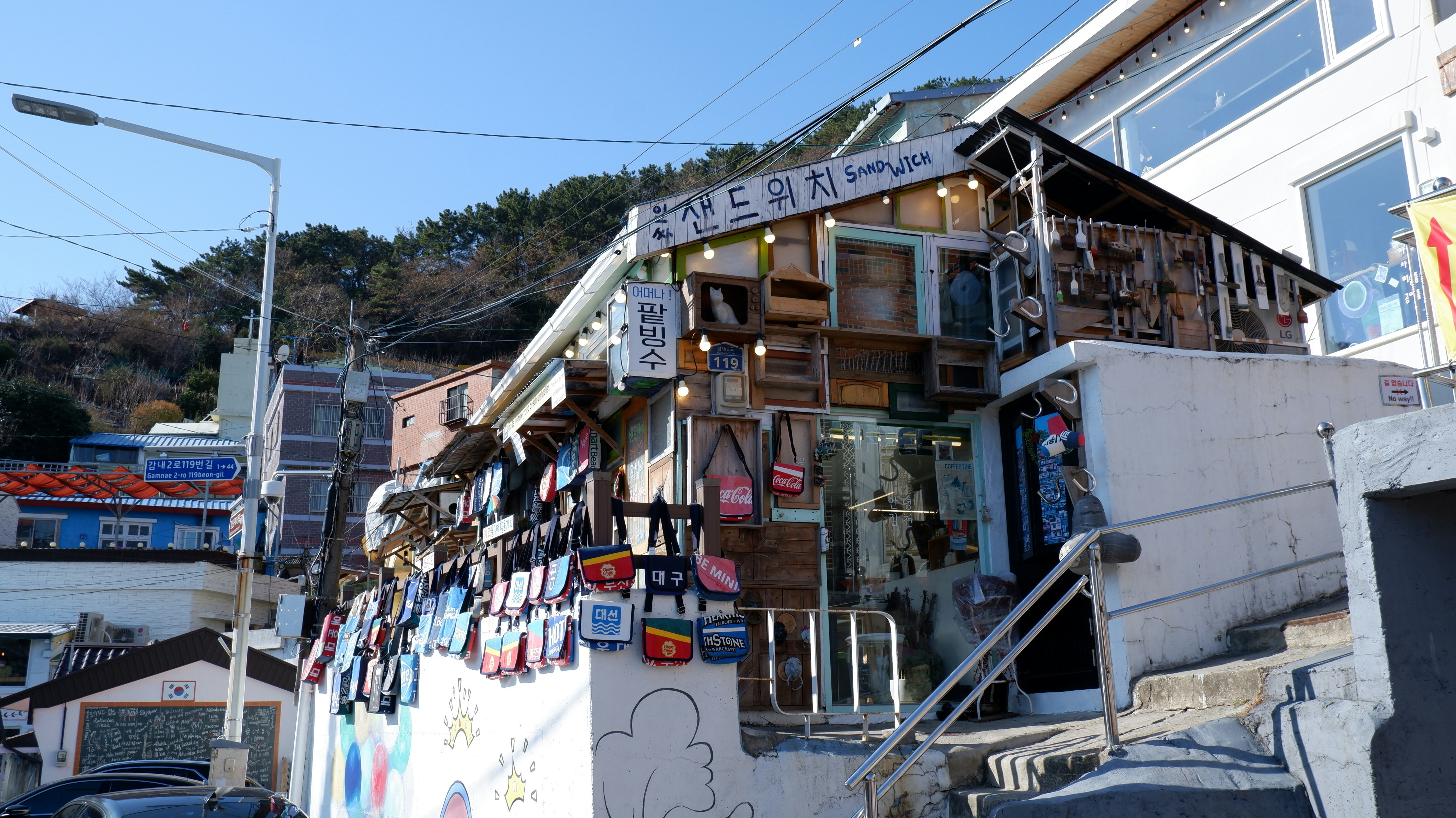 Colorful seaside cantina: a stairway to a quirky stacked cafe