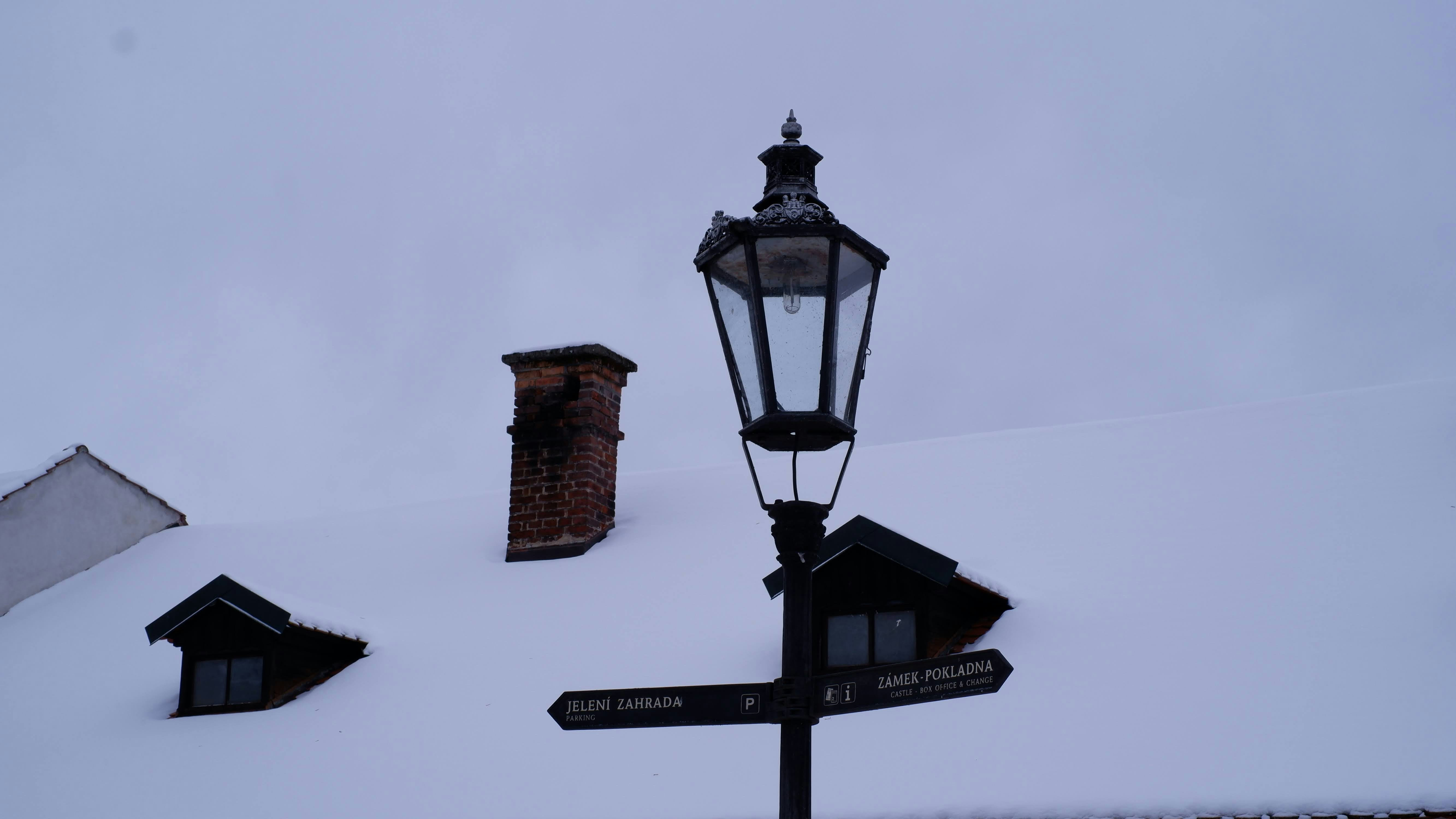 Snowbound Lantern Over a Corner of Winter Roof