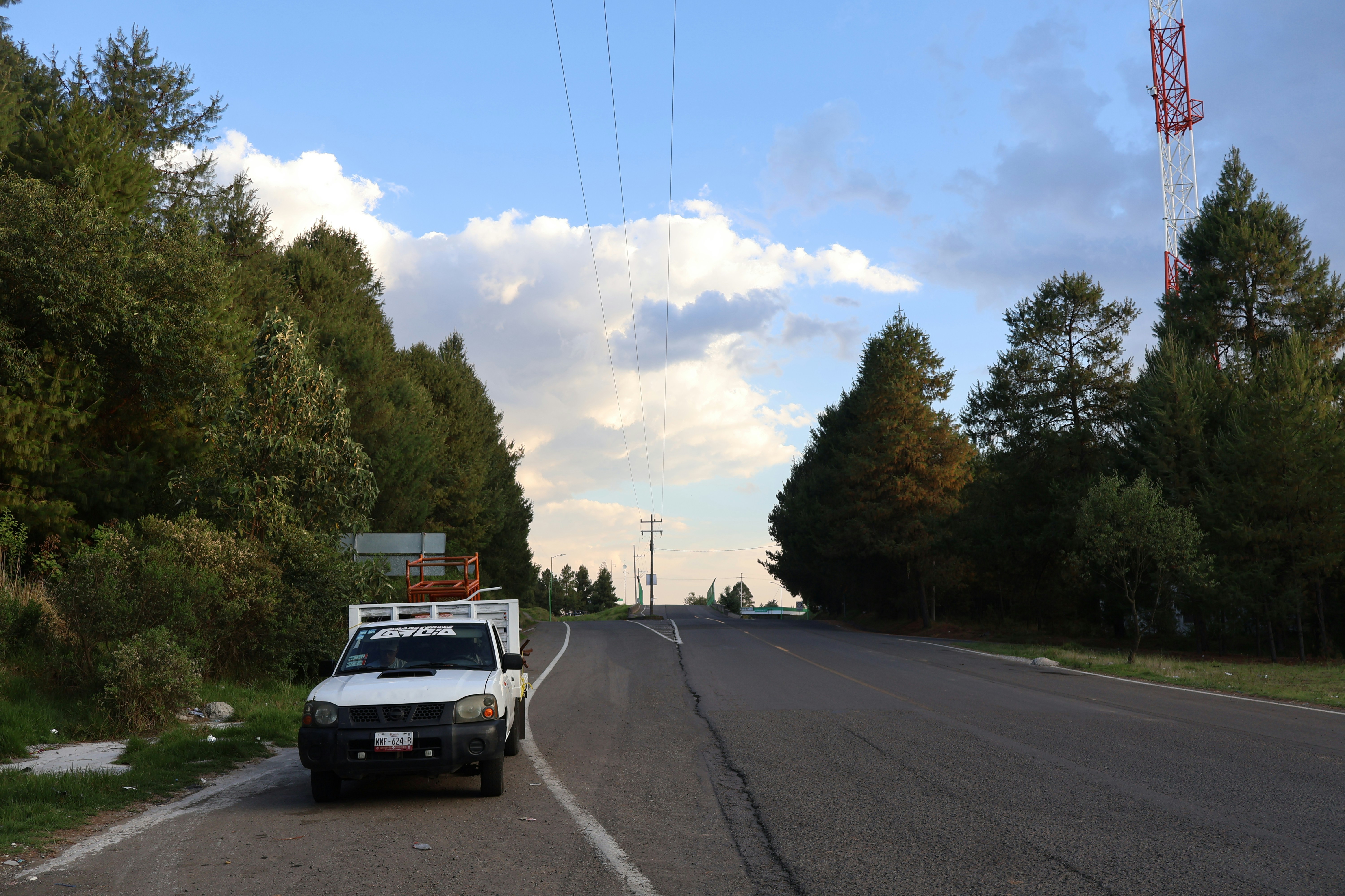Rural Roadside Scene with Parked Utility Vehicle