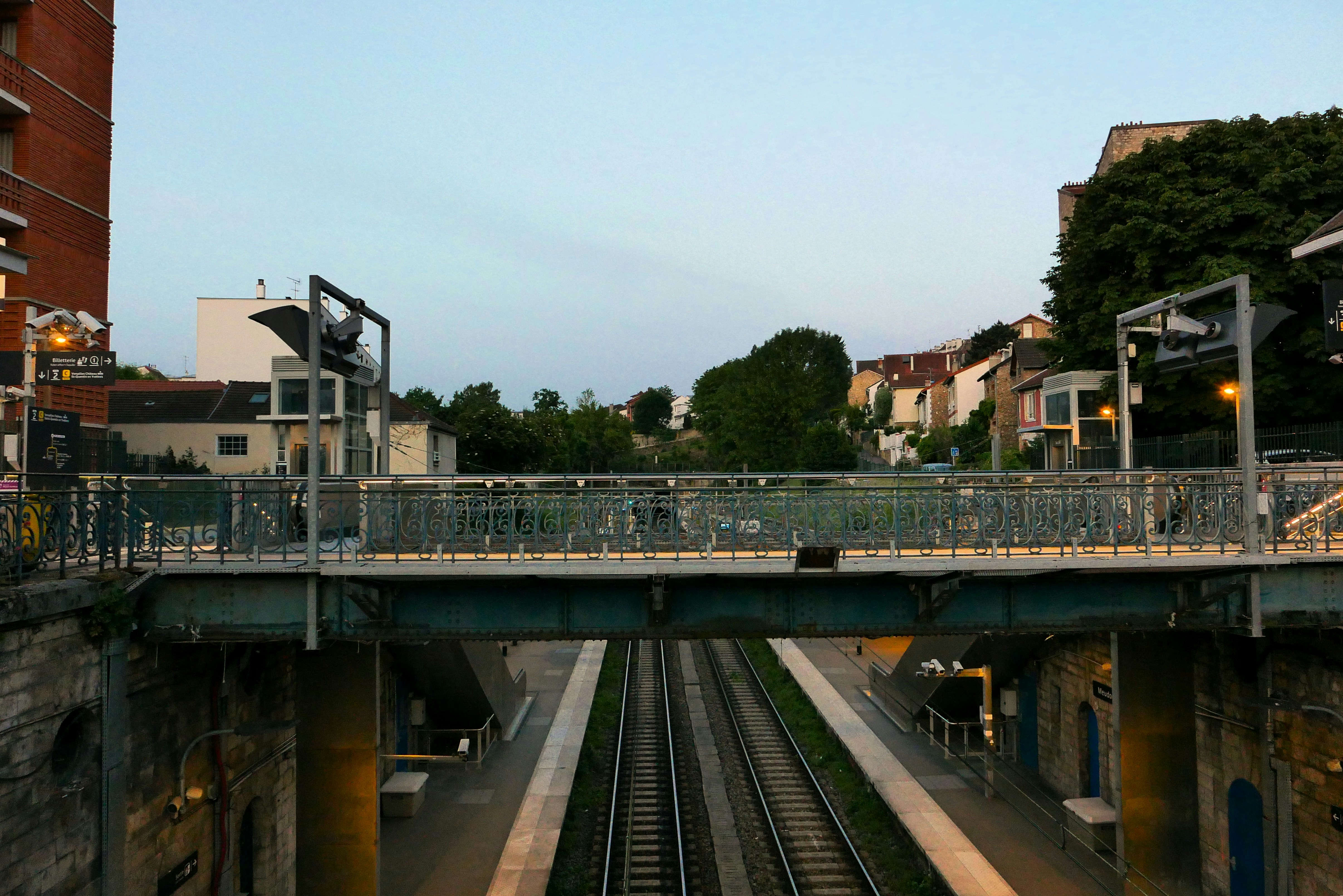 Tracks to the City: A Quiet Platform Under the Bridge