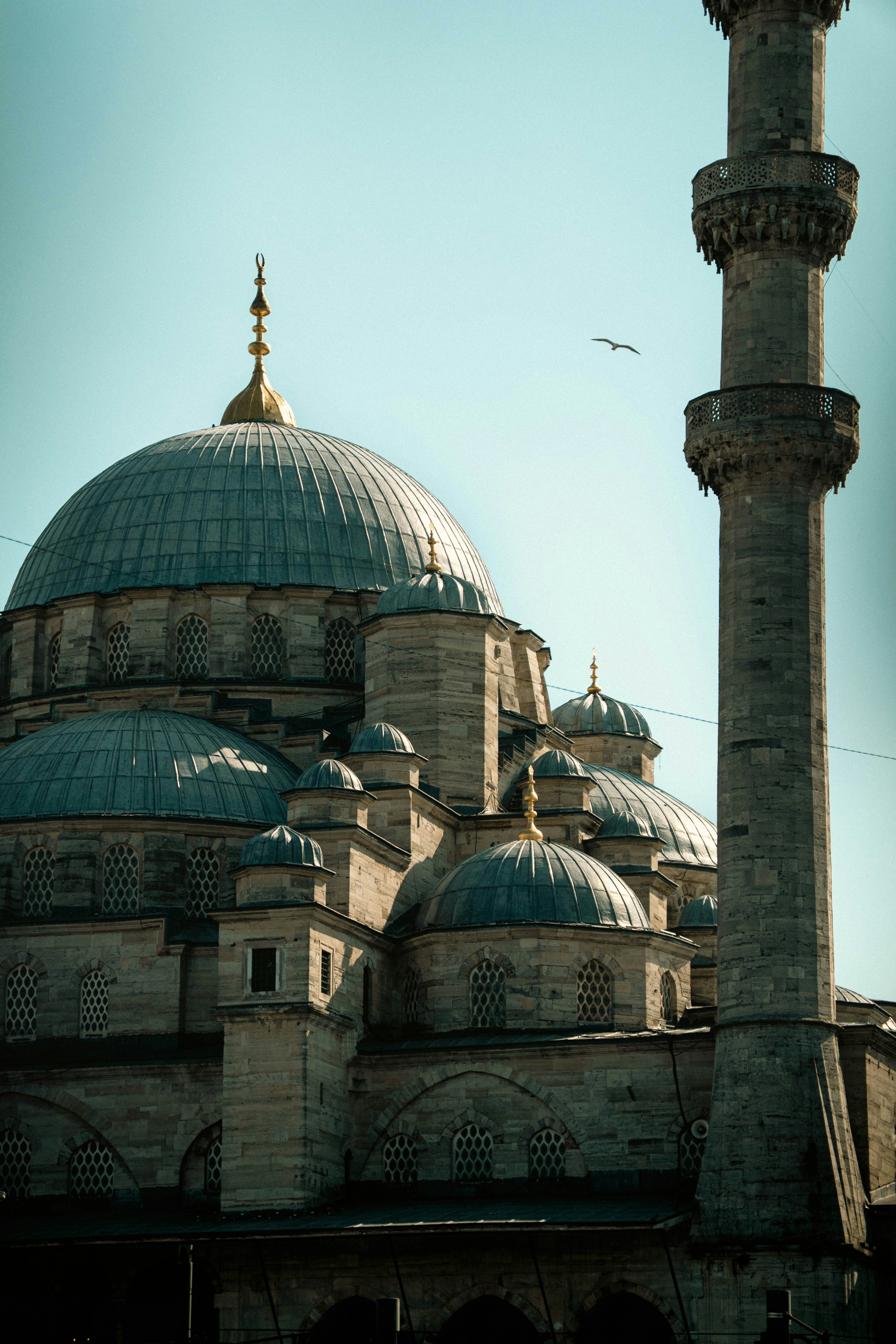 Dome and Minaret Rising Over Stone Facades