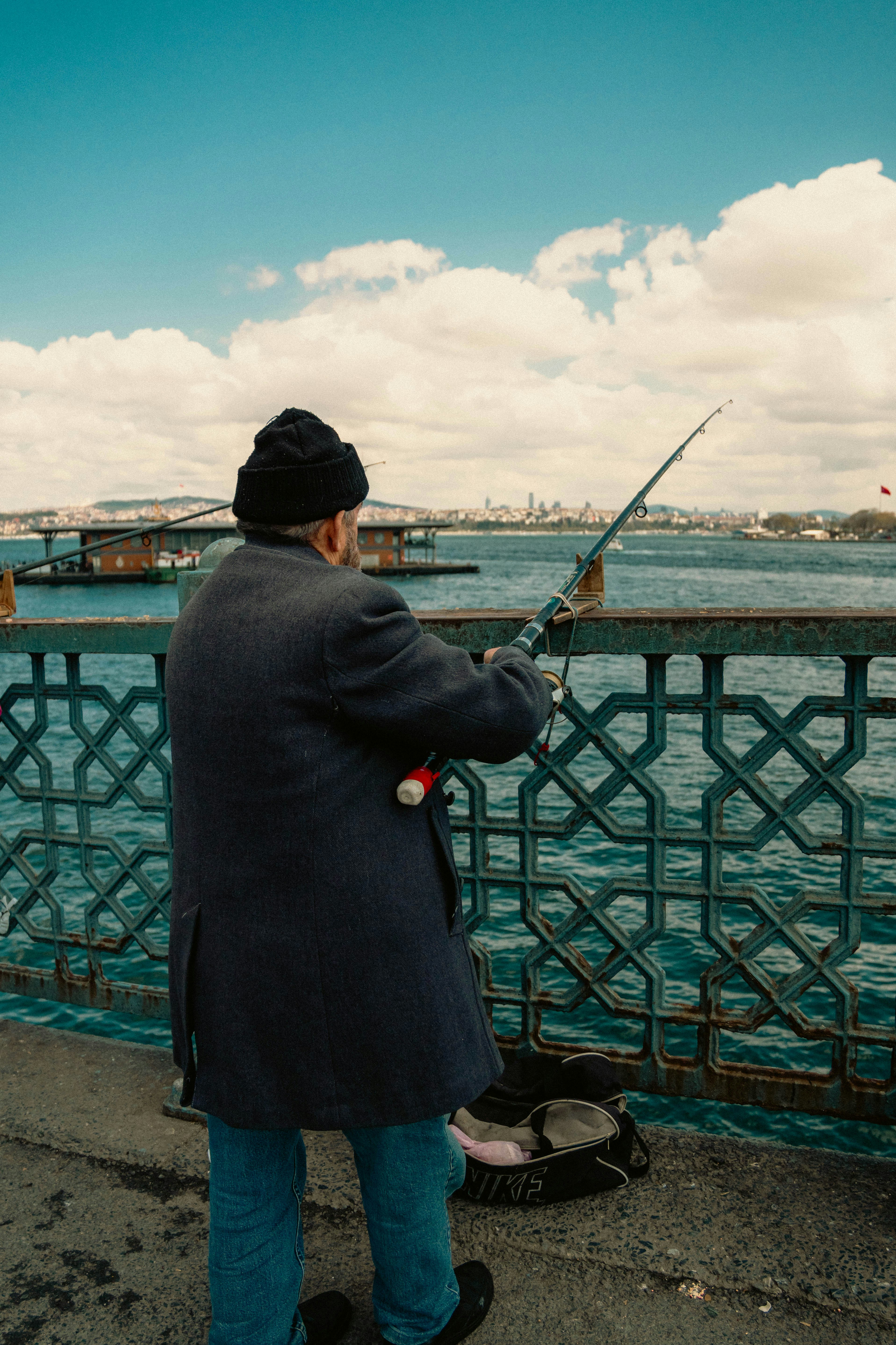 Old-World Angler at the Waterfront