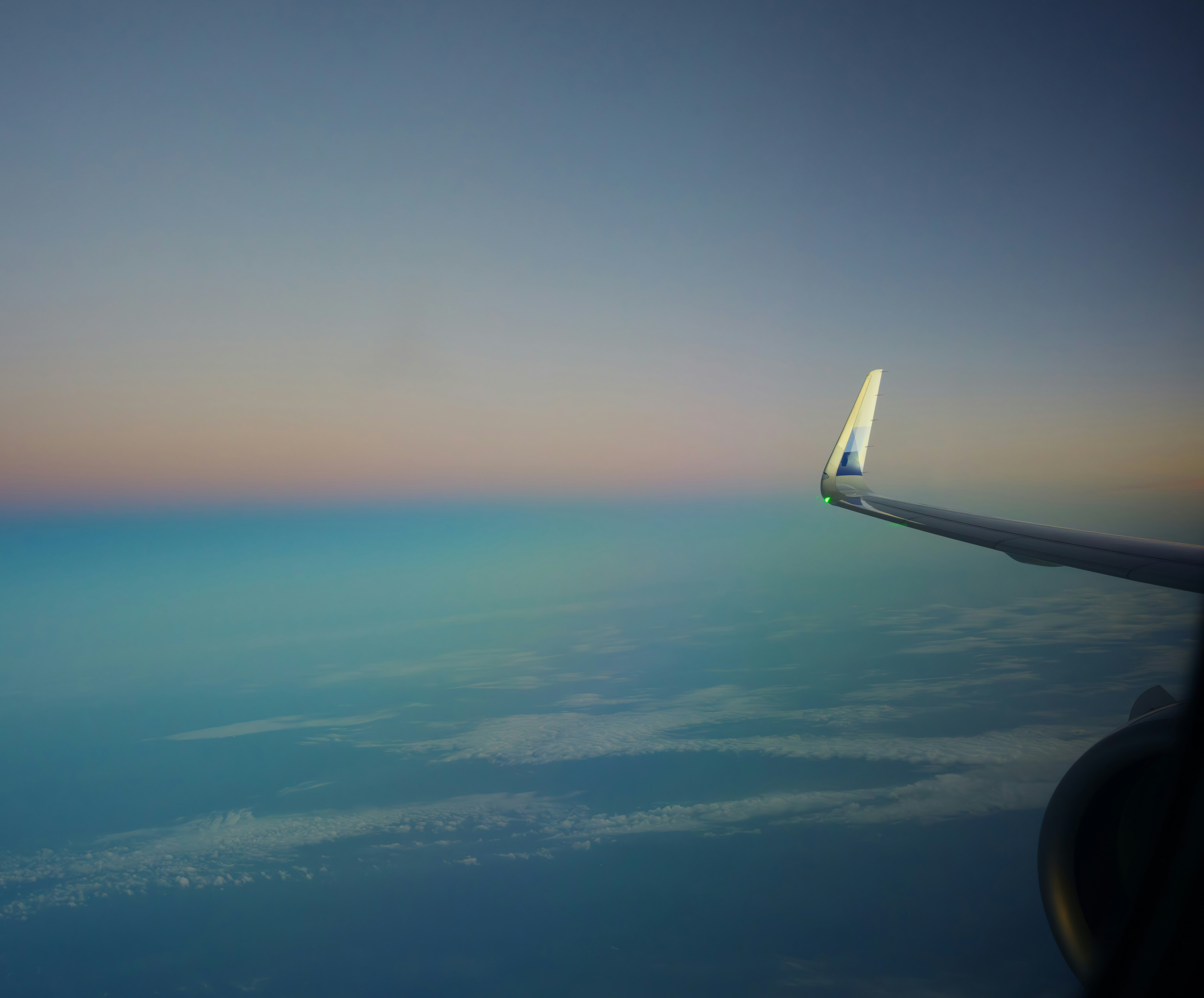 Wingtip at Sunset: A Quiet Moment Over the Curve of Earth