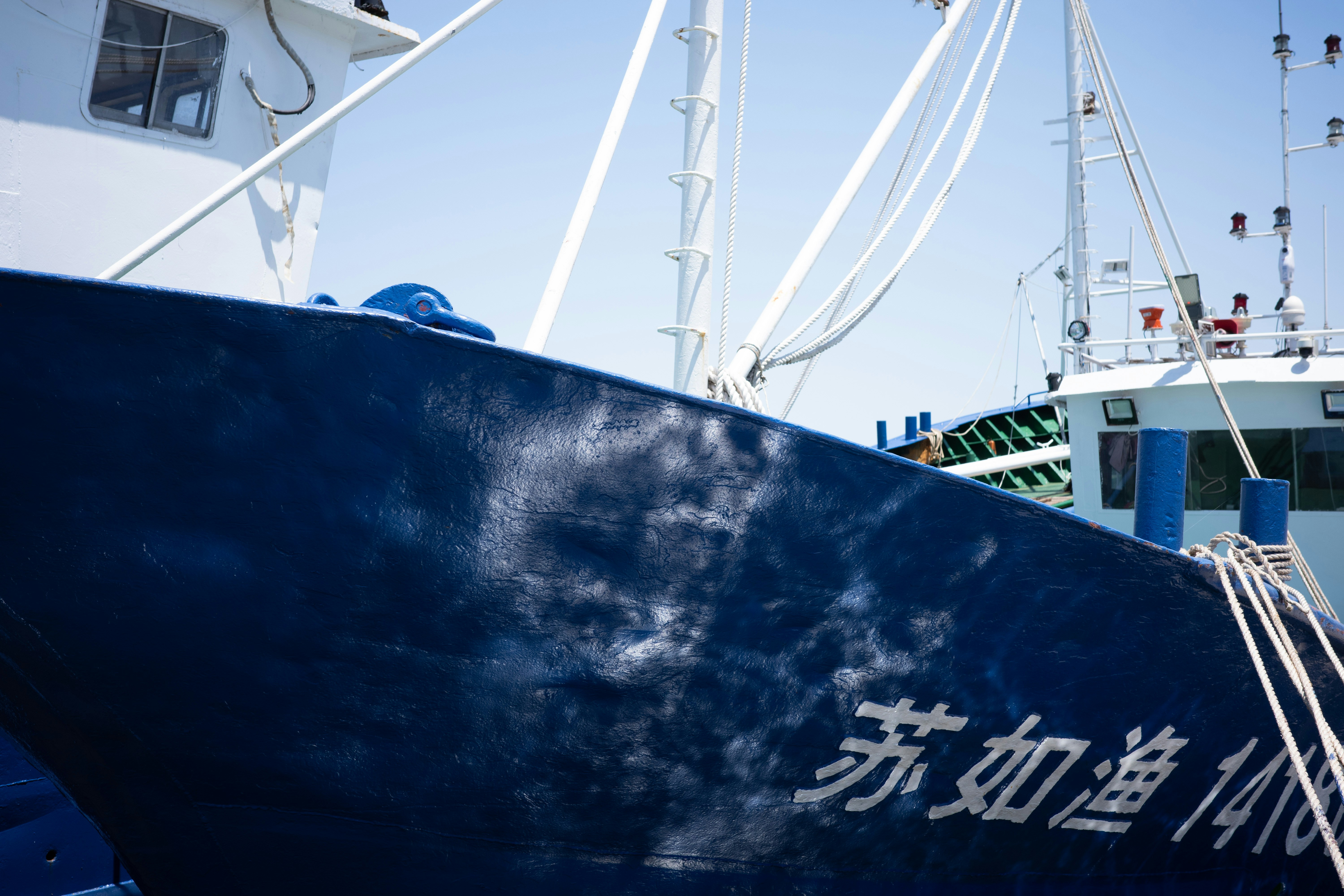 Hull in Focus: Midnight Blue Vessel at Dock