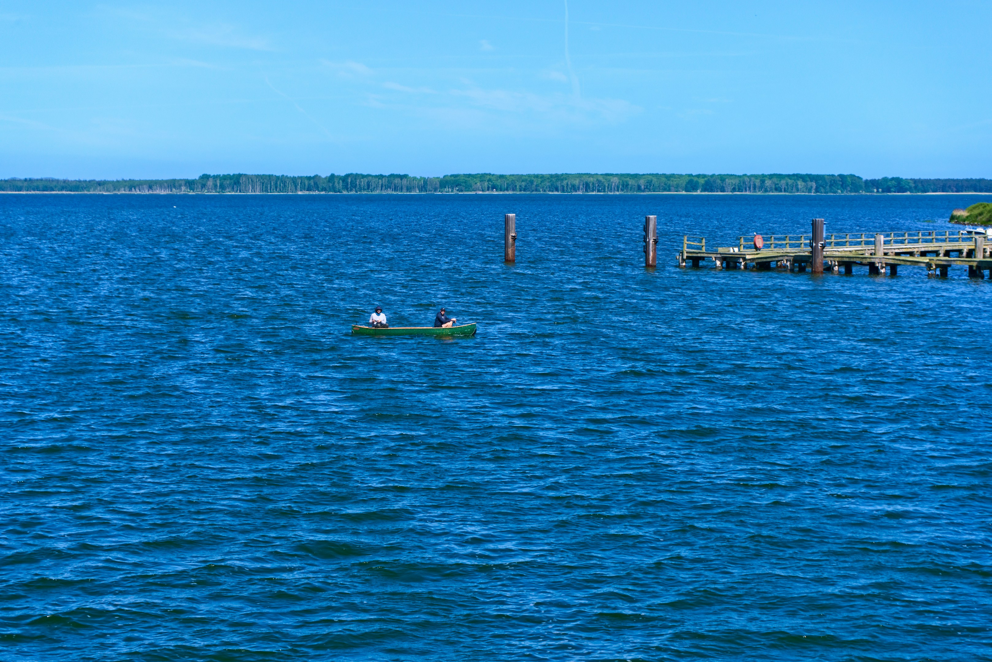 Lonely Boat on a Wide Blue Expanse