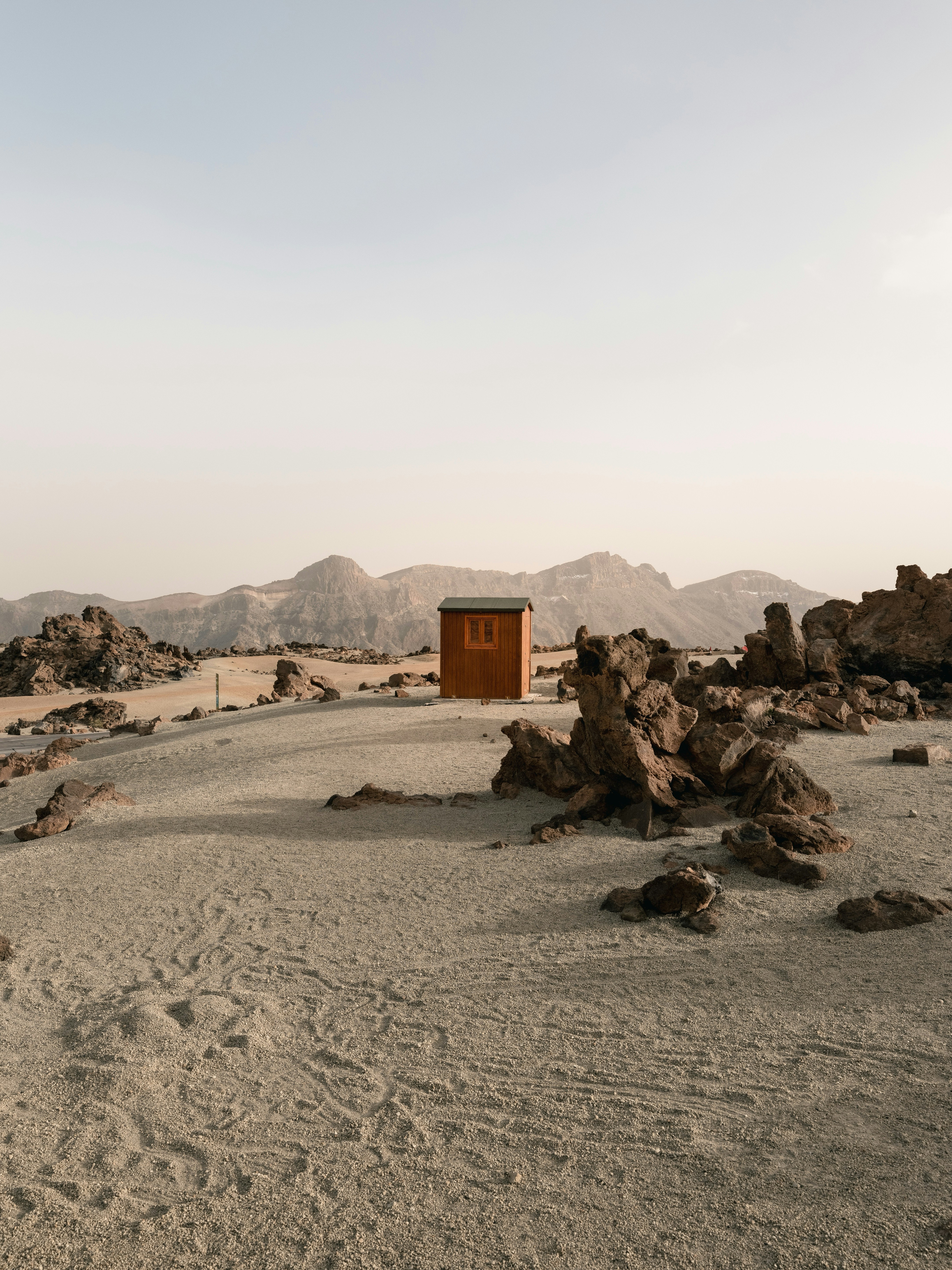 Desert Outpost: A Small Cabin Amid Stony Silence