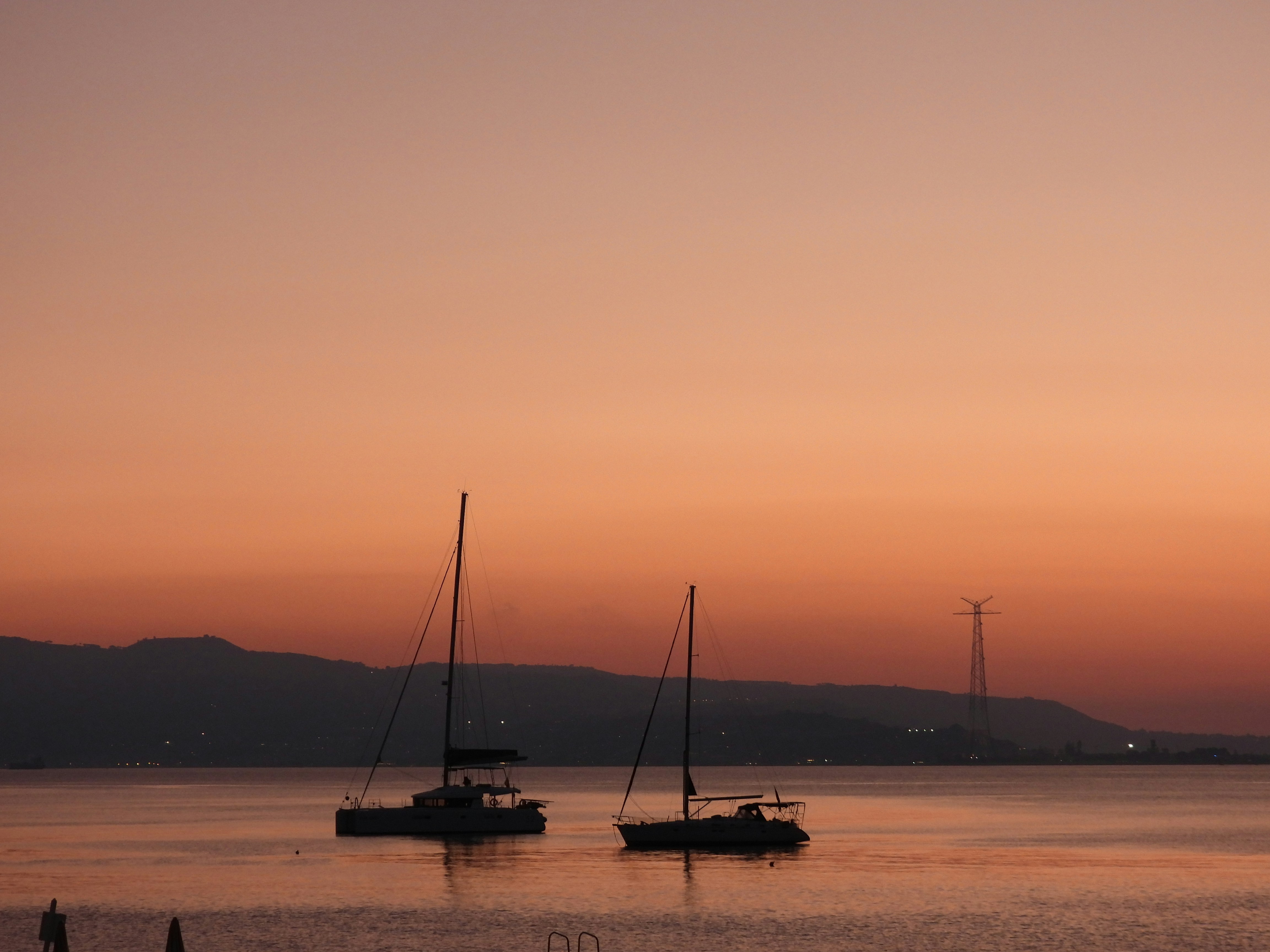 Dusk on the Bay: Sails Resting, Horizon Quiet