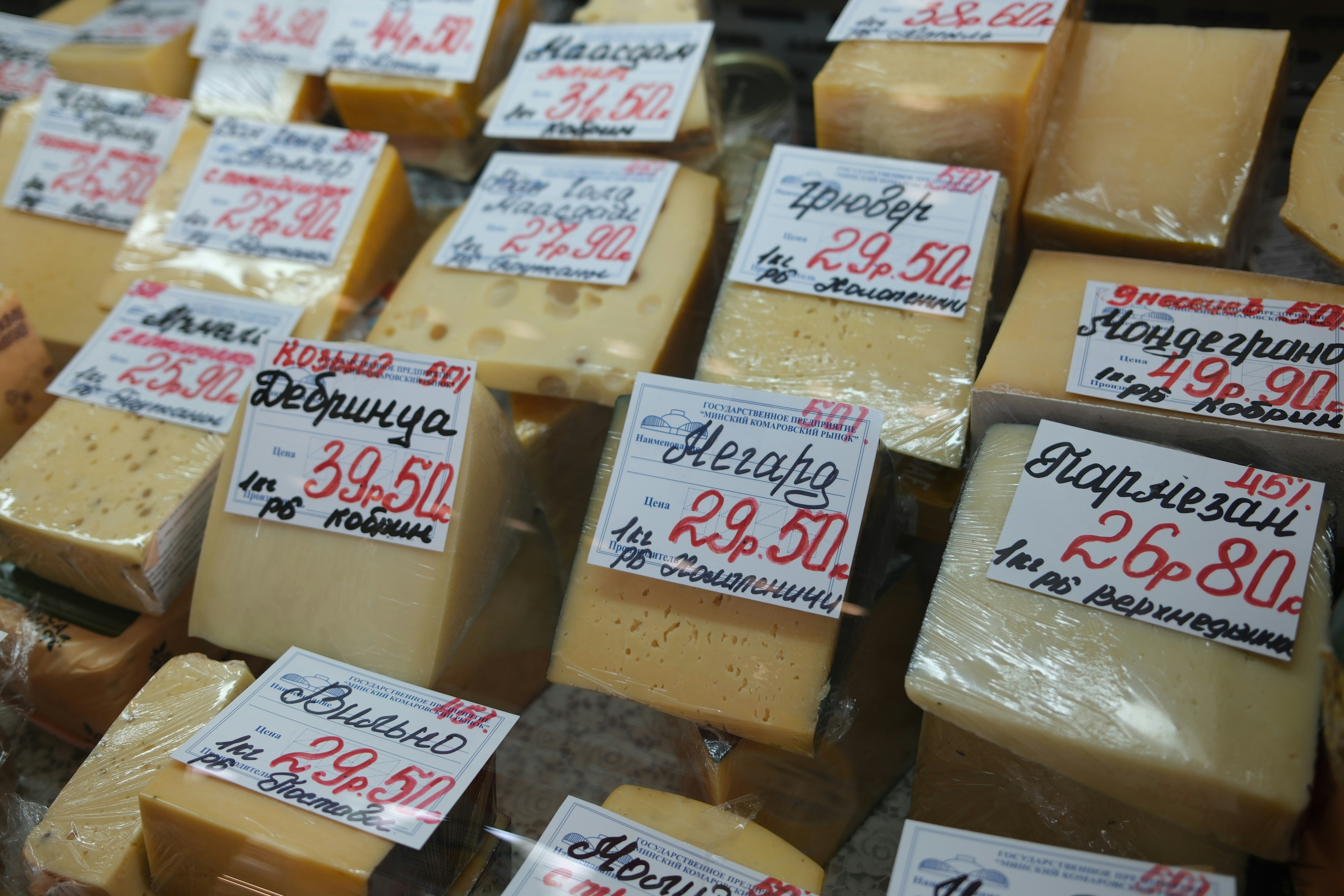 Curated Blocks of Artisan Cheese: Labels in Focus
