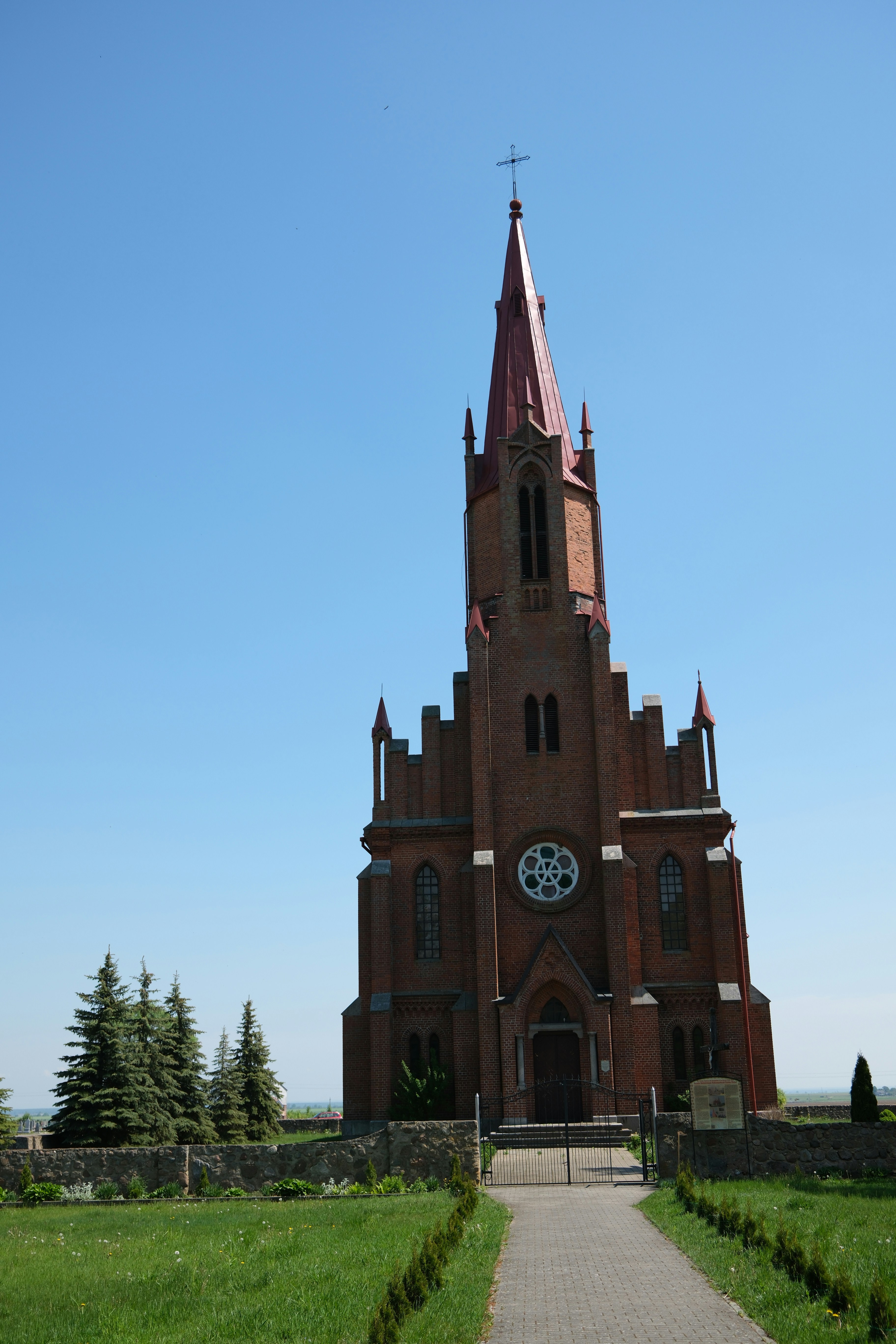 Gothic Brick Church Reaching Toward a Clear Sky
