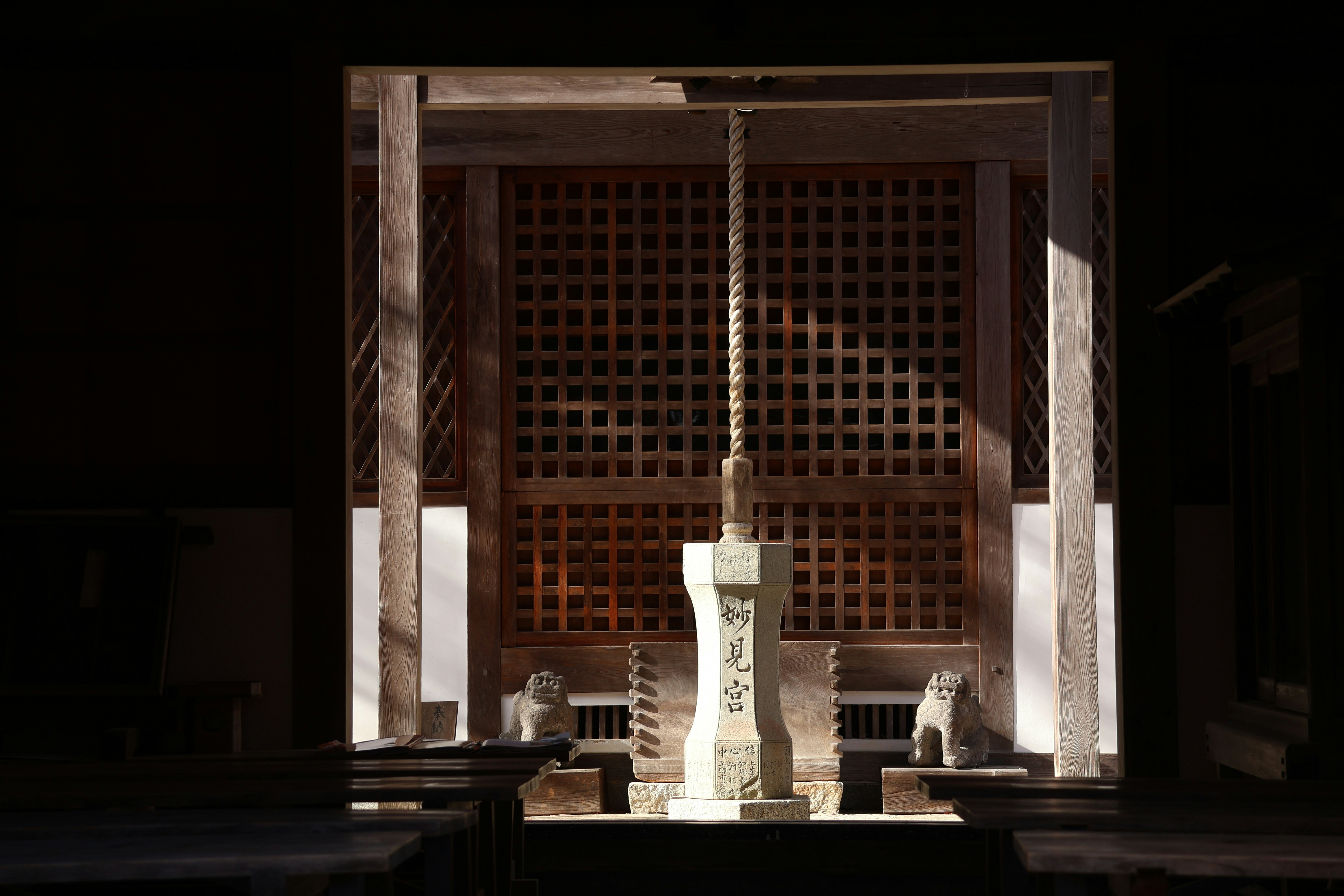 Centered Sacred Bell: Light and Shadow on a Temple Altar