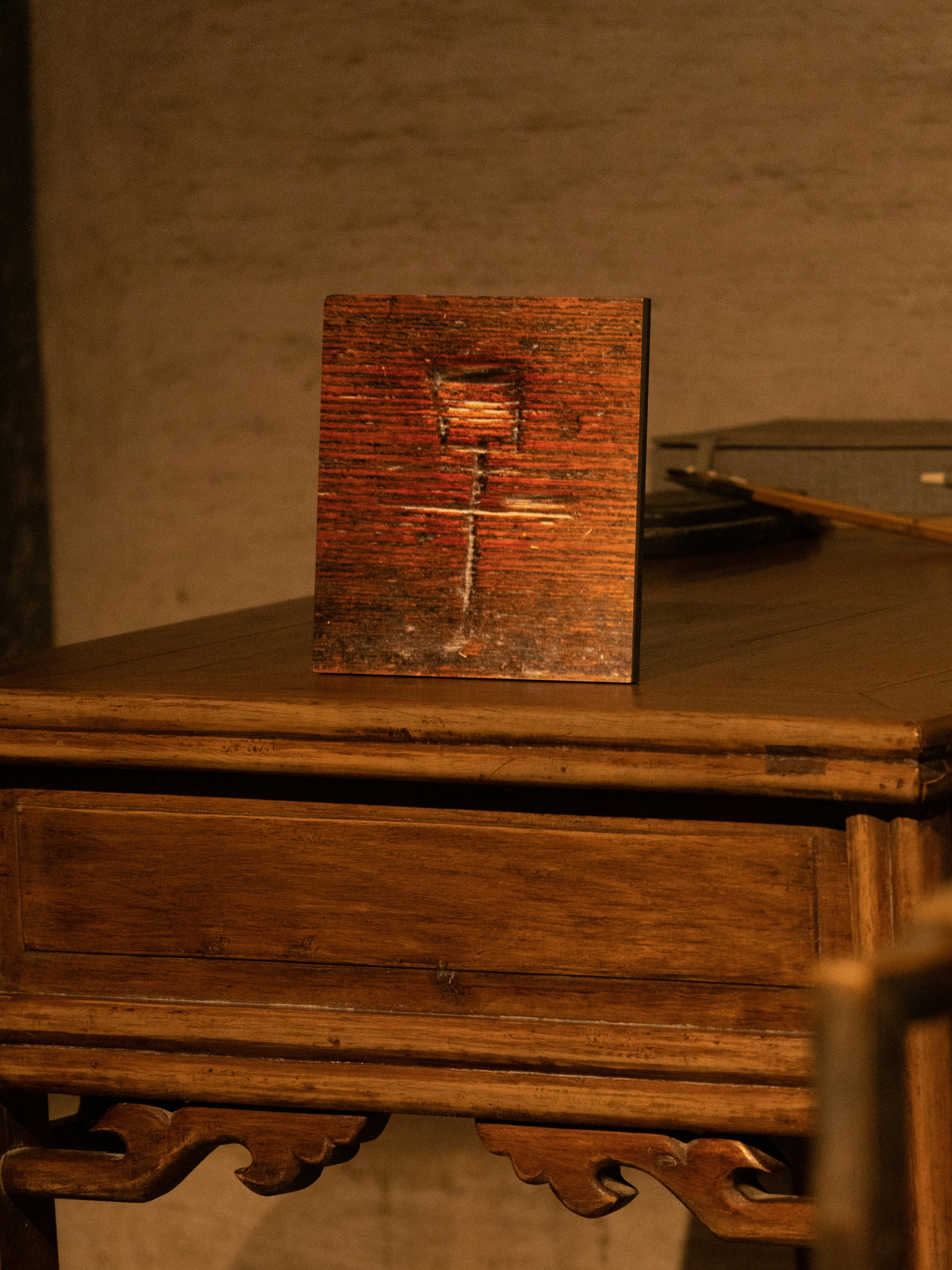 Rustic Portrait of a Shaving-Shaded Cube on a Wooden Desk