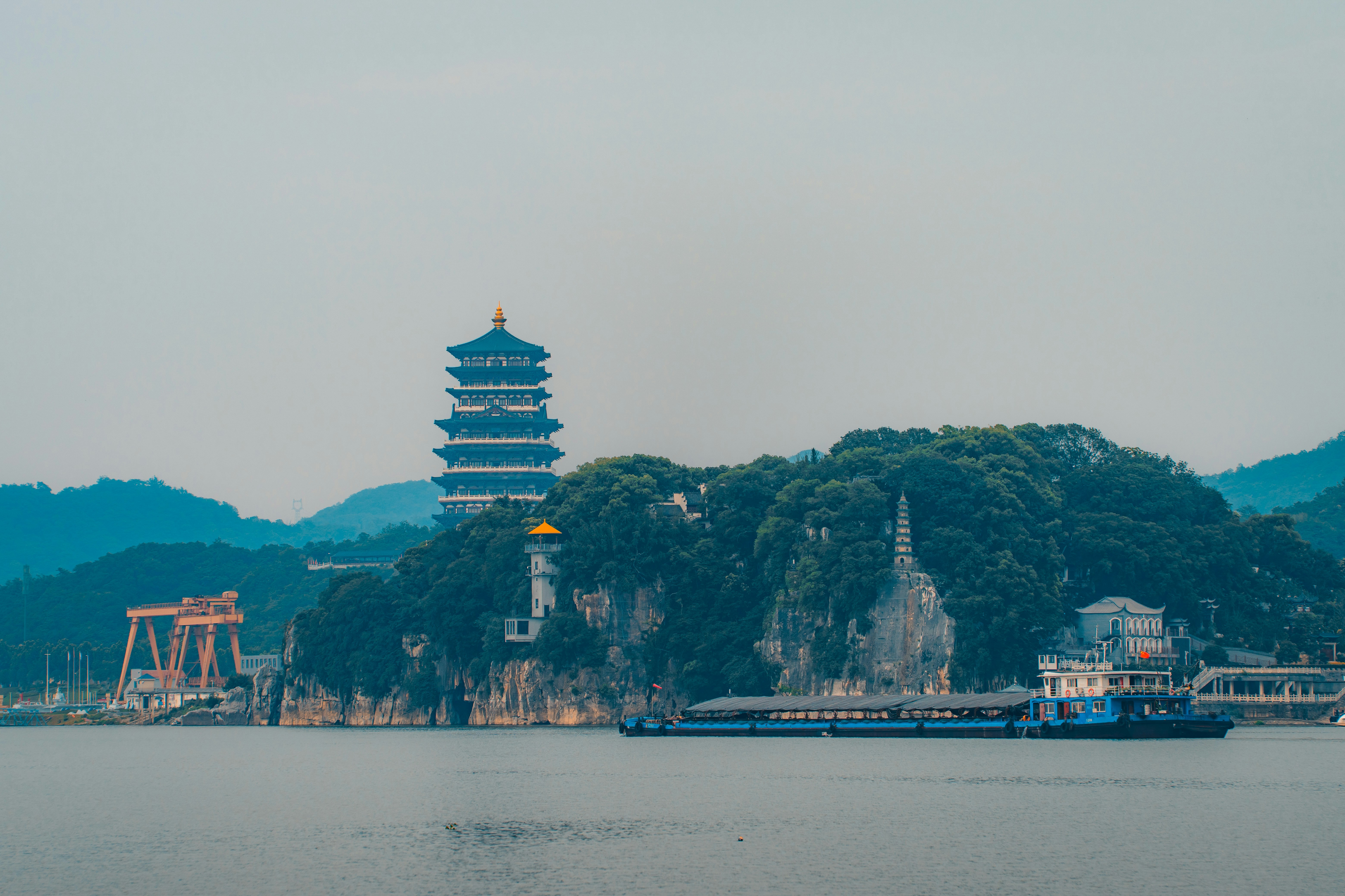 Temple on the Misty Island: A Seascape of Silhouetted Cliffs and Pagoda