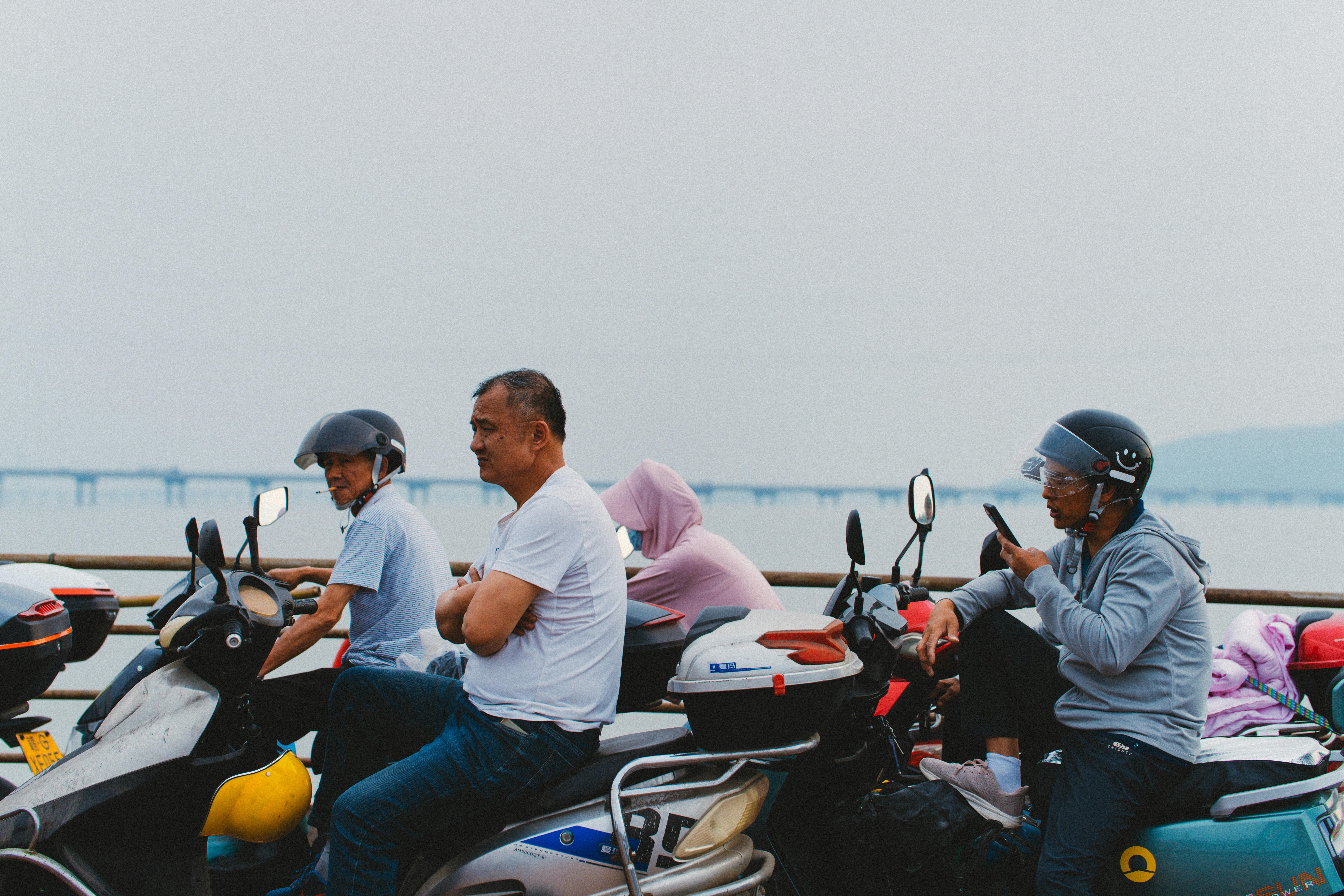Riders in Quiet Convergence: A Waterfront Moment