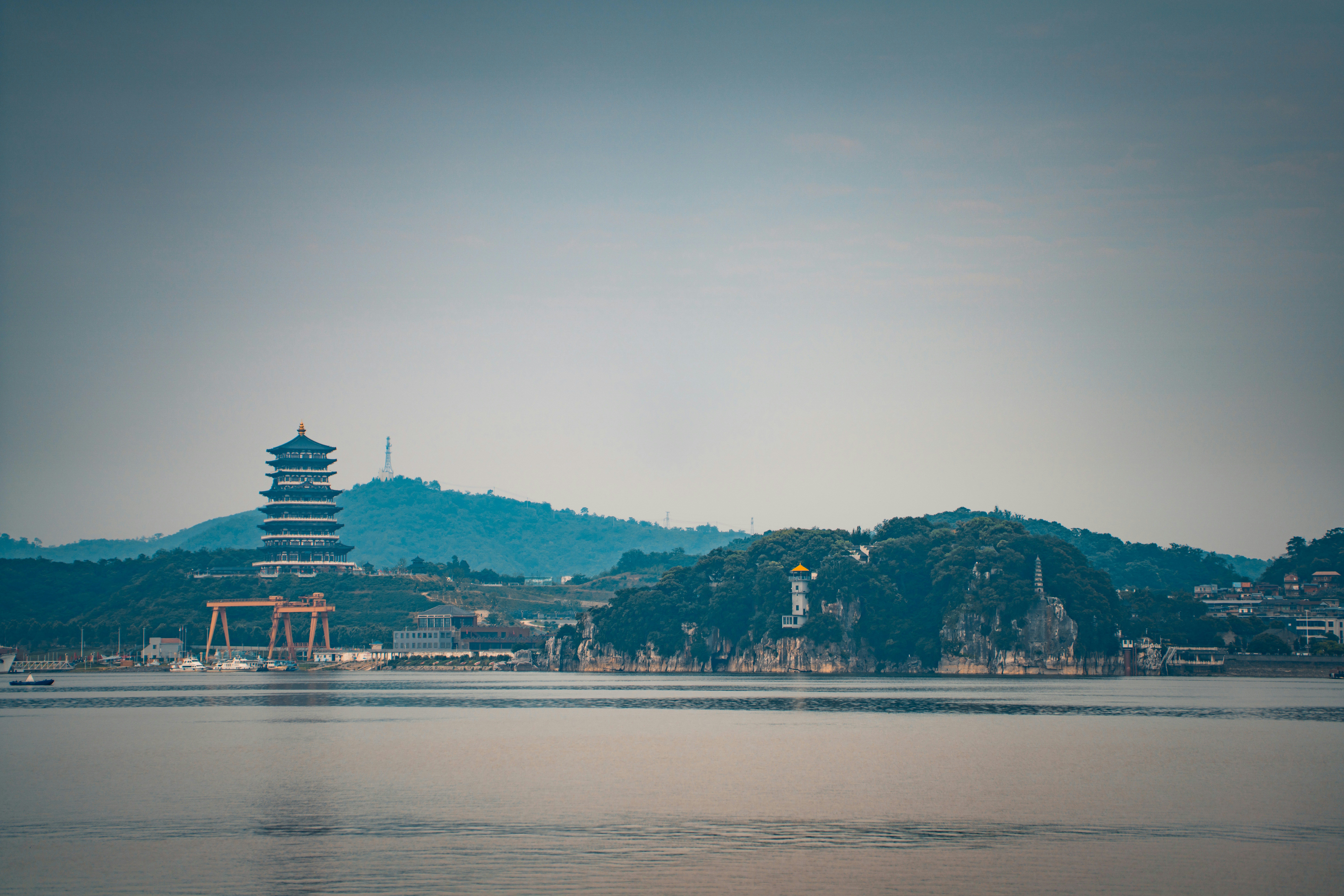 Harmony on the River: A Pagoda and Island Silhouette at Dusk
