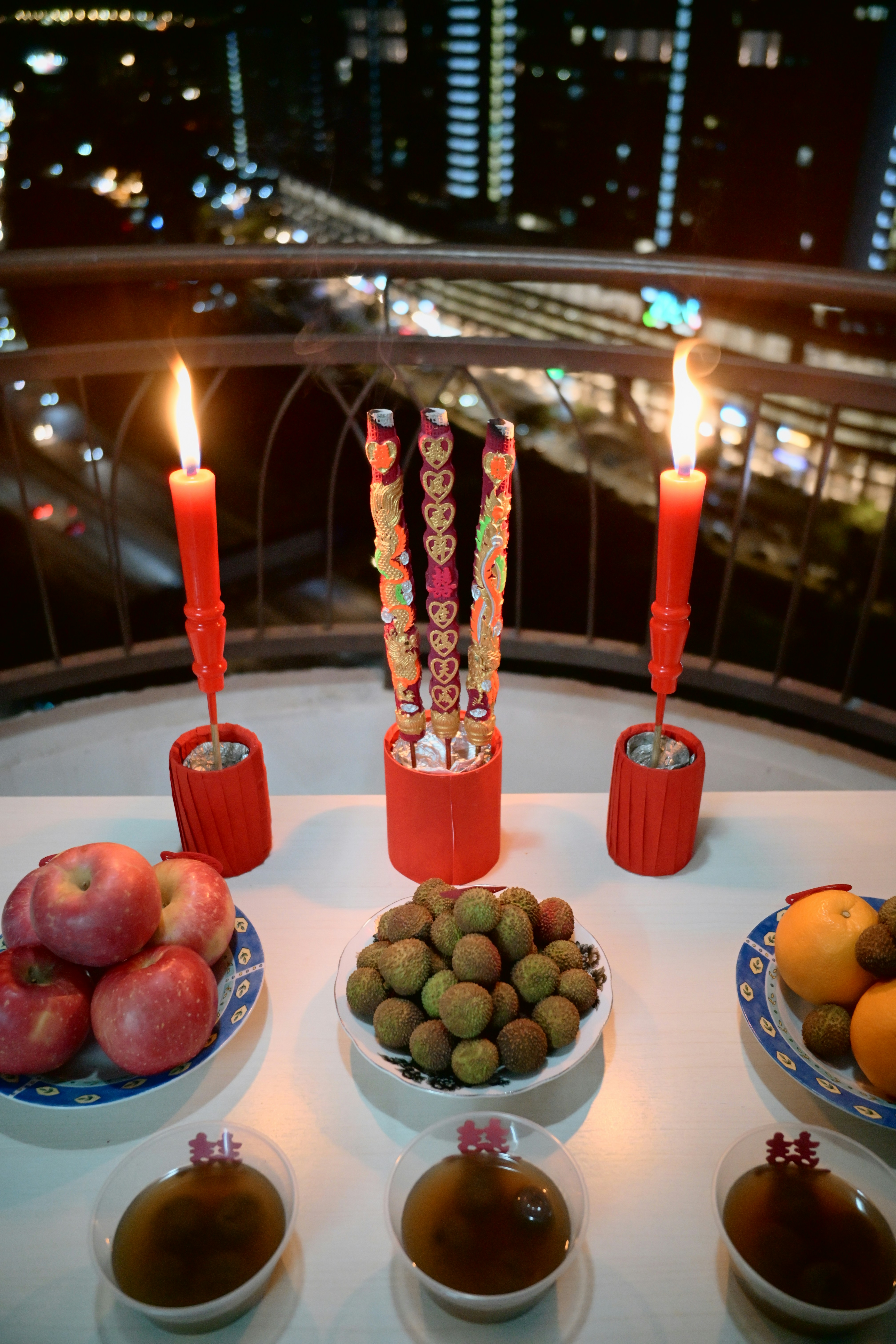 Candles and Candied Skewers: Night Market Table Setting on a City Balcony