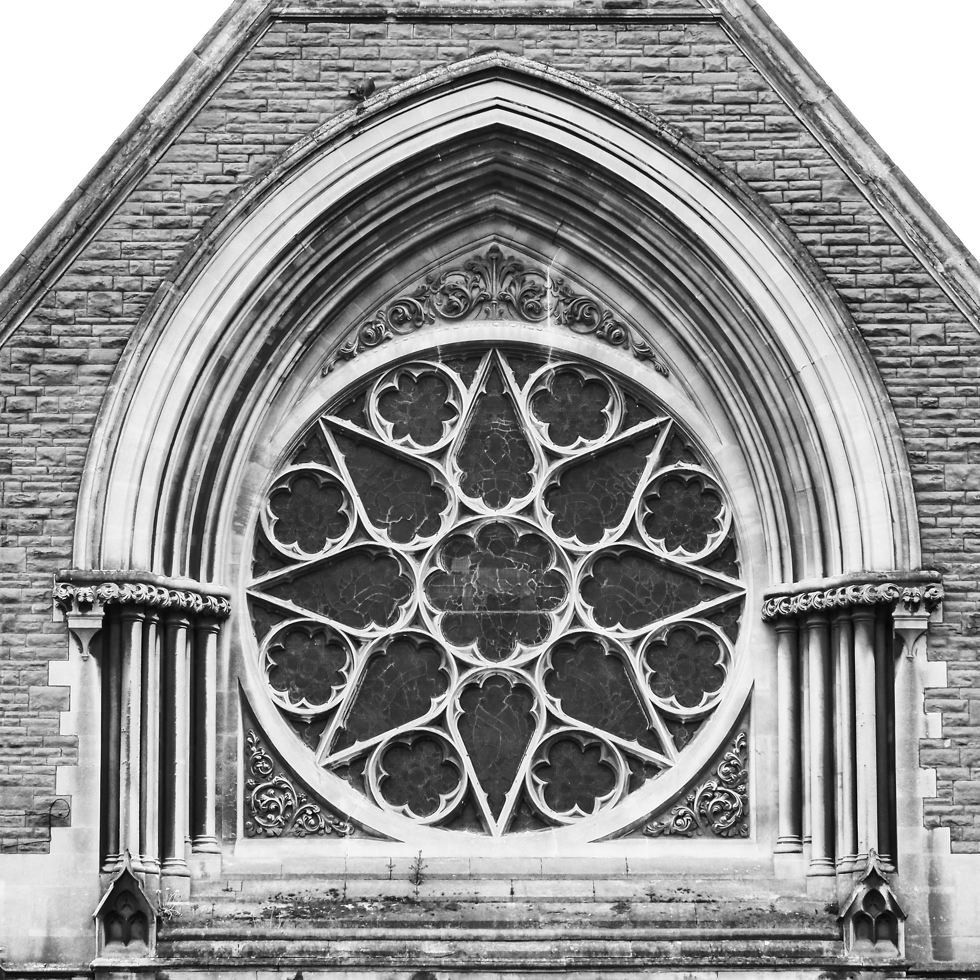 Gothic Rose Window in Weathered Stone Facade