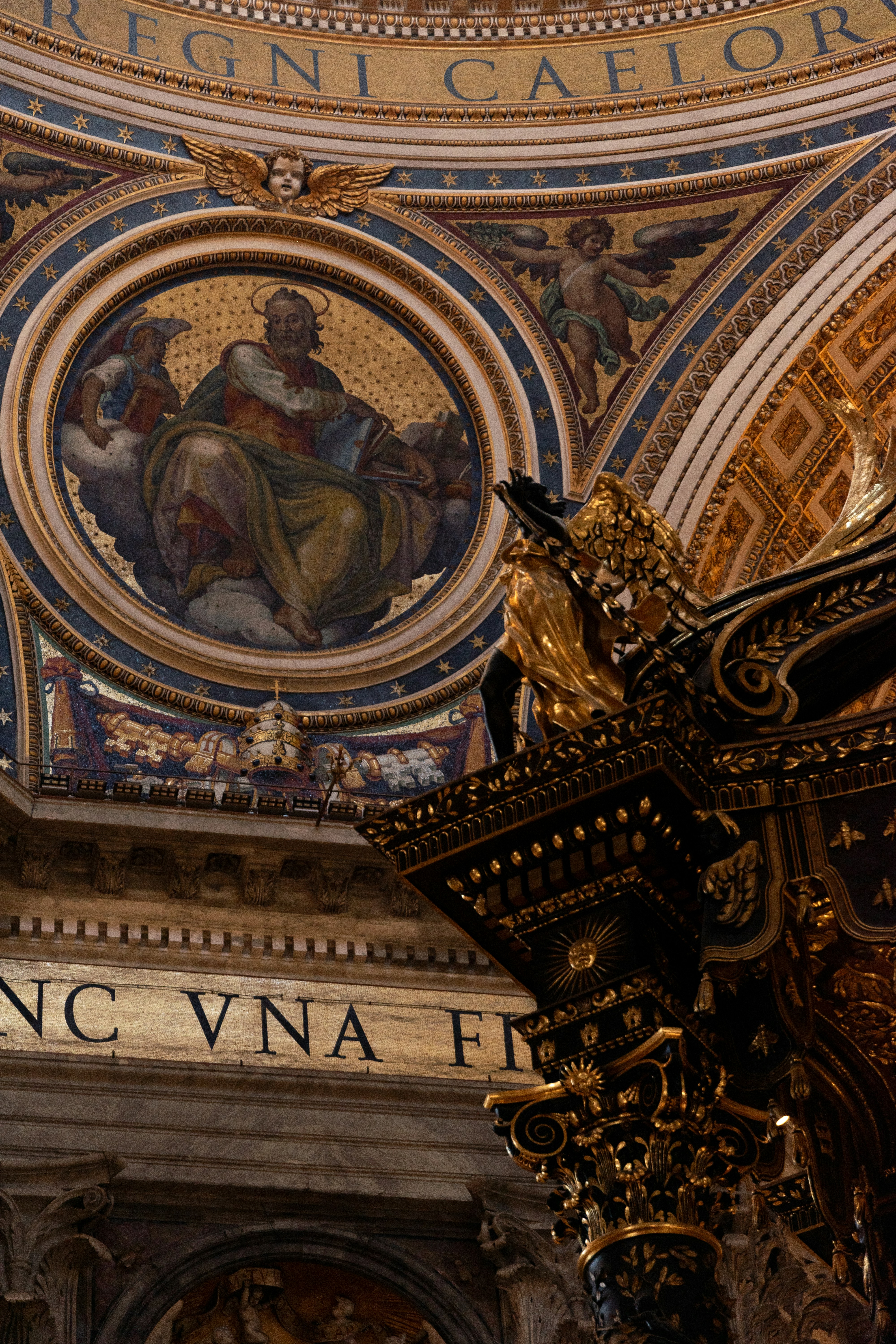 Ivory and gold: divine imagery cresting a cathedral dome