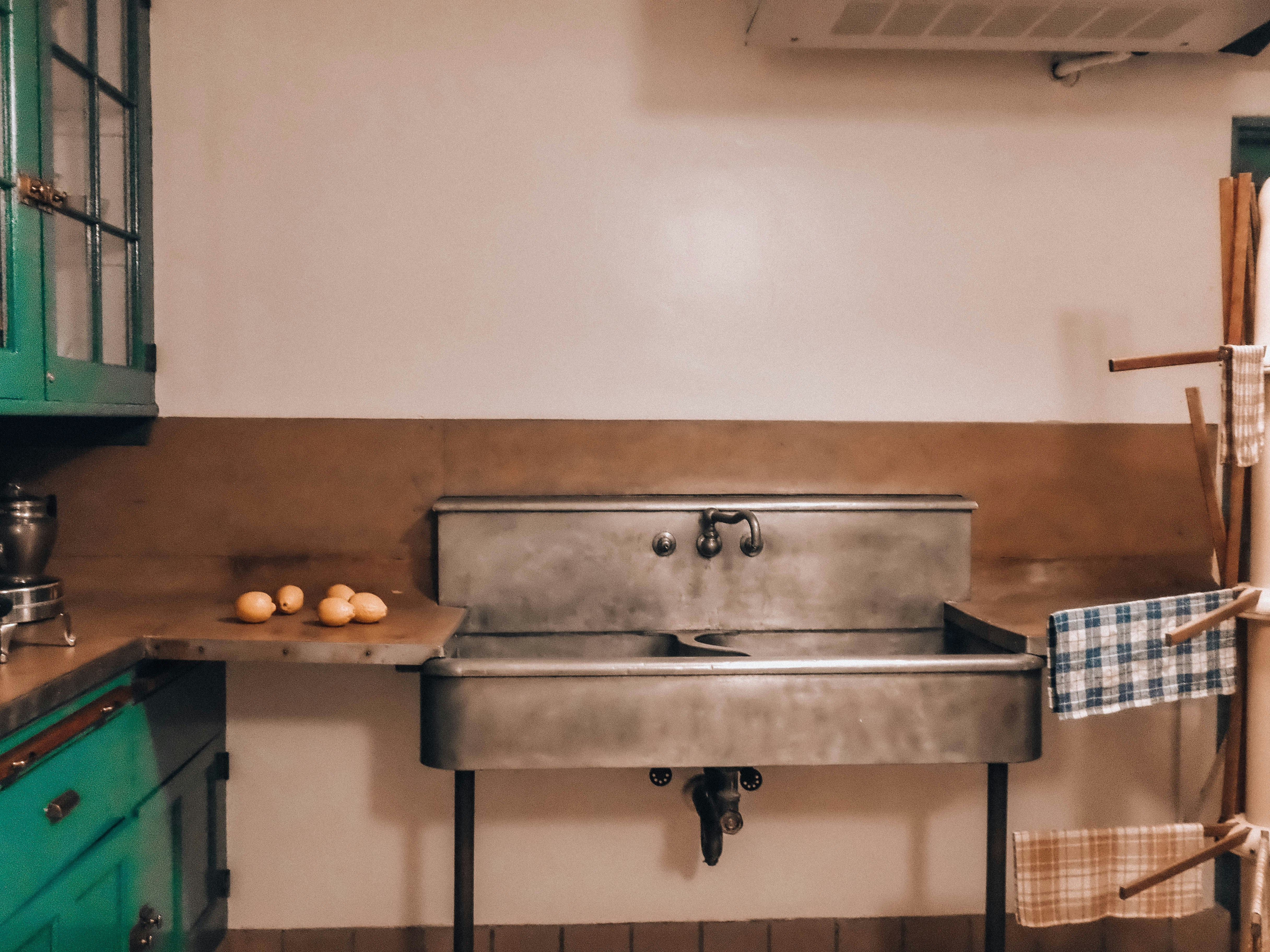 Industrial Sink Halo: A Quiet Kitchen Corner with Sunlit Steel