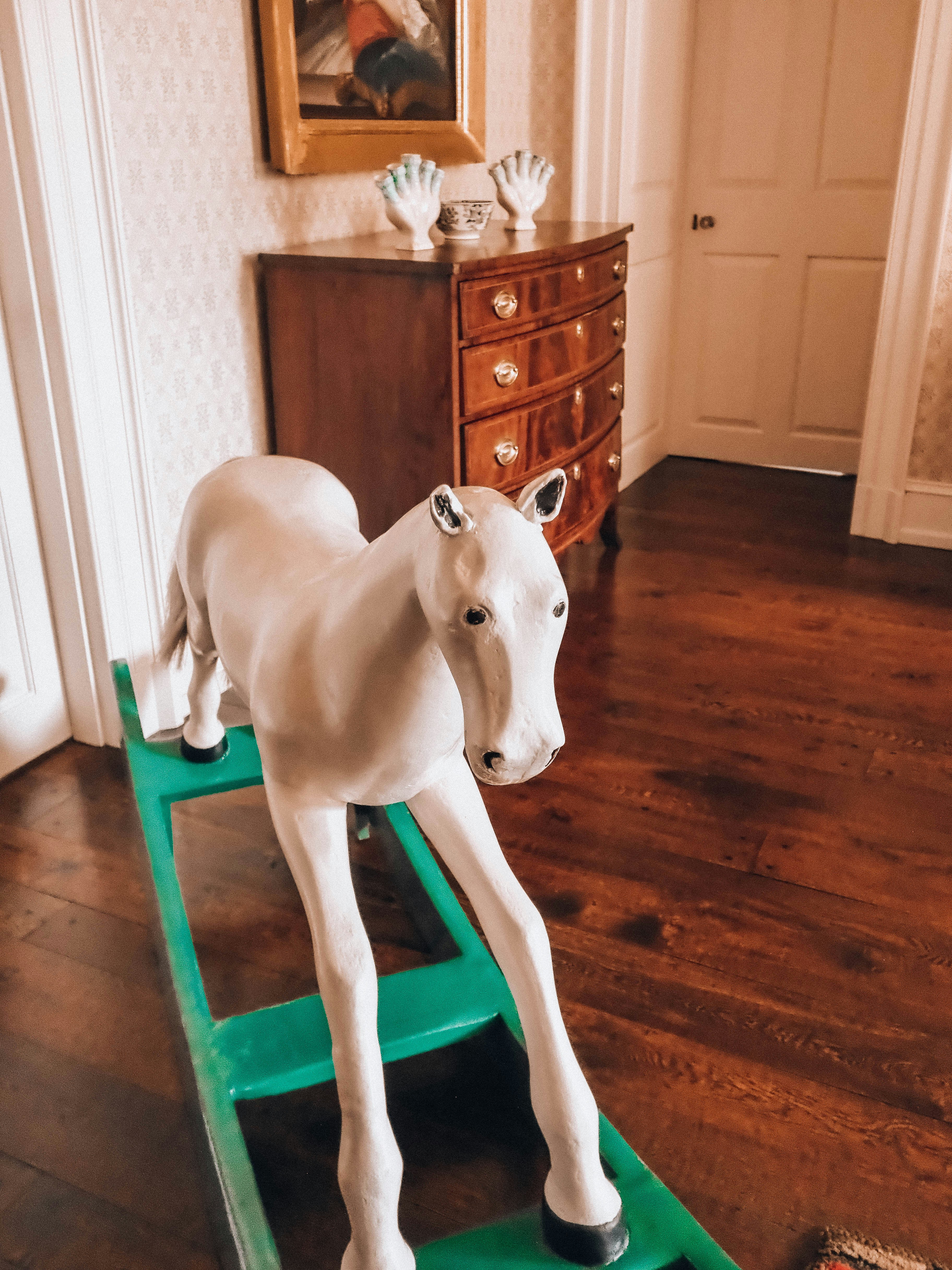 White Horse Figurine on a Green Step Stool in Vintage Flaming Room