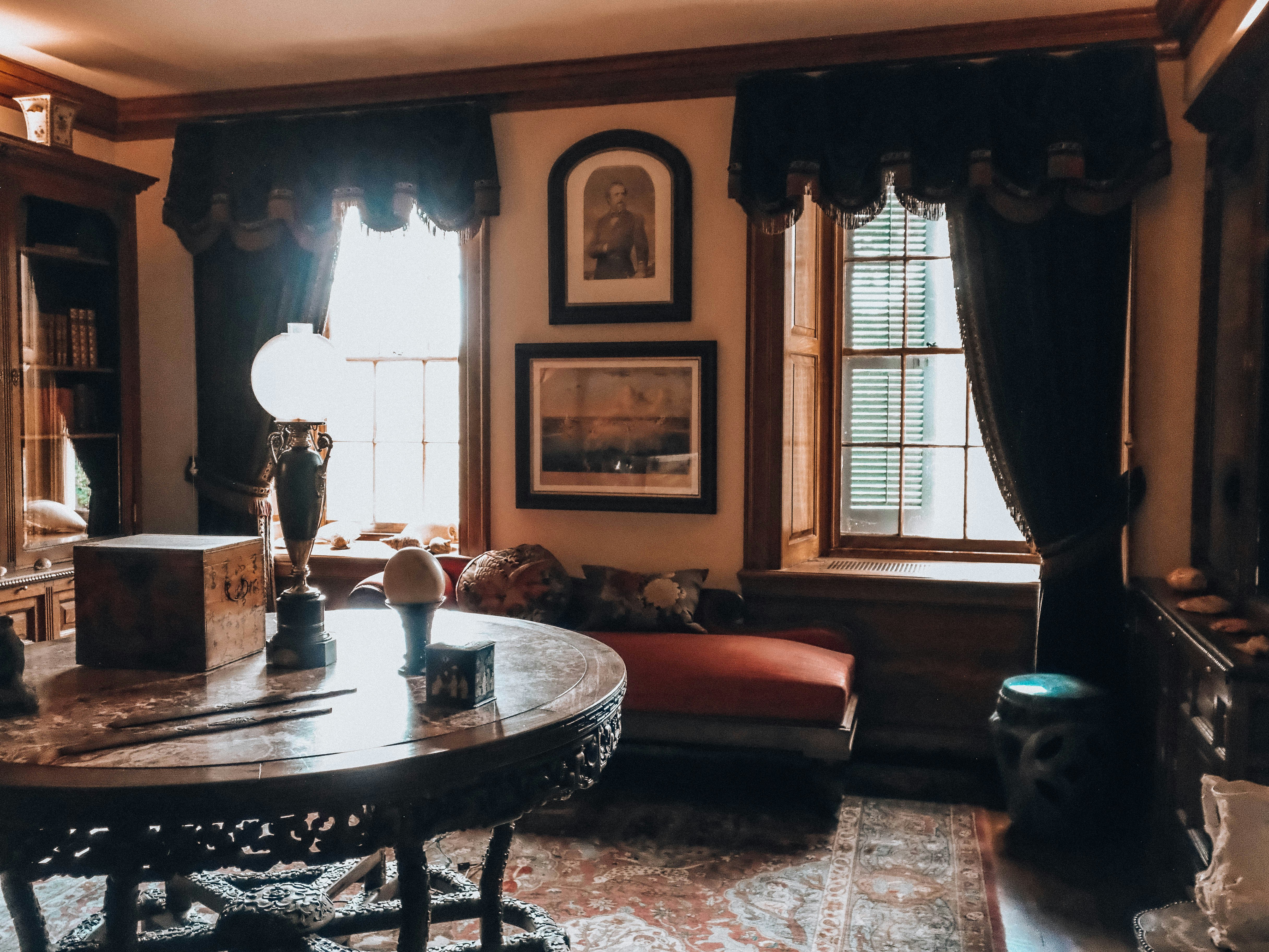 Dim parlor, warm glow: a vintage study bathed in lamplight