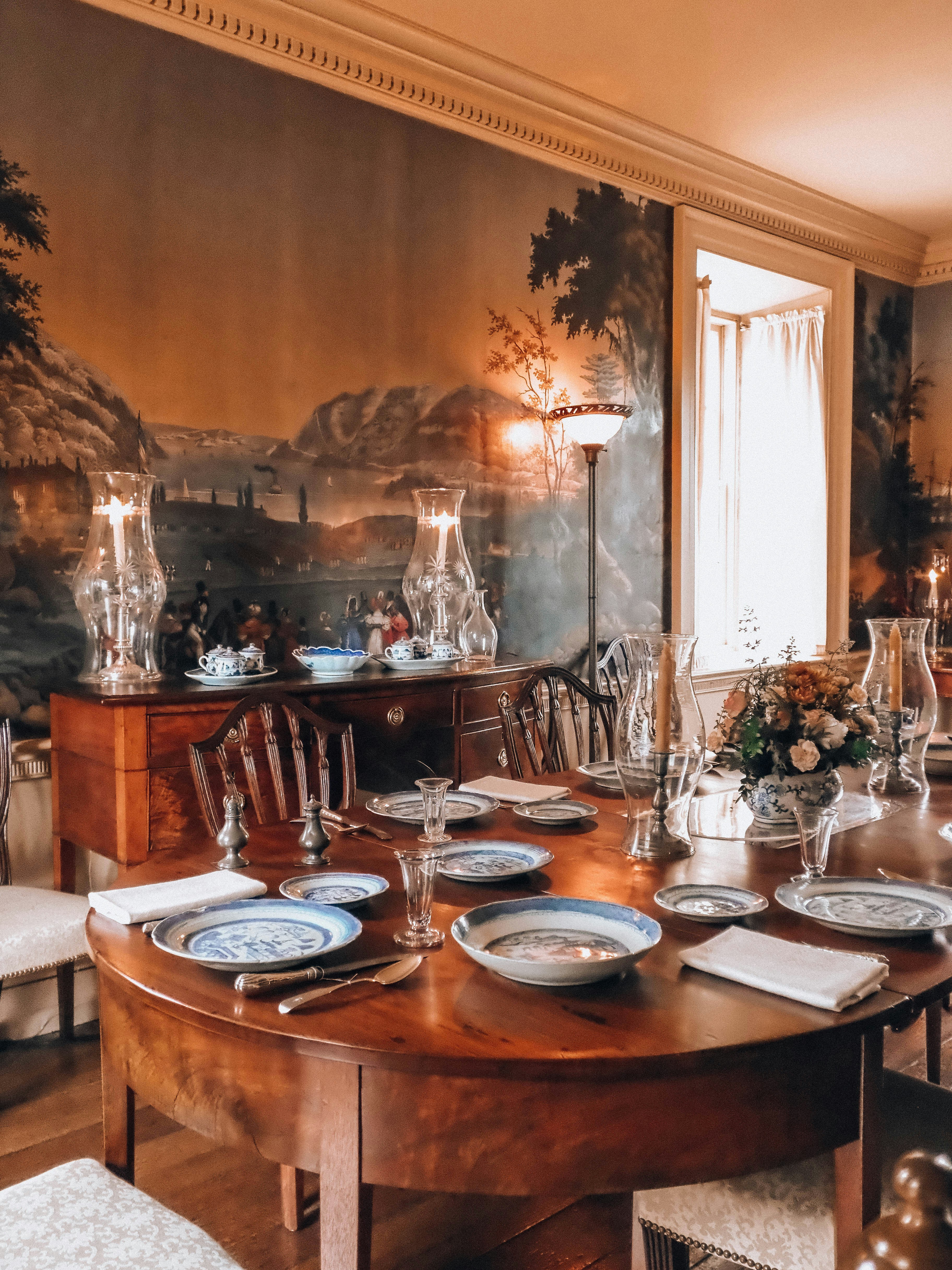 Sunlit Dining Portrait: Island of Glassware and Lace in Warm Hue