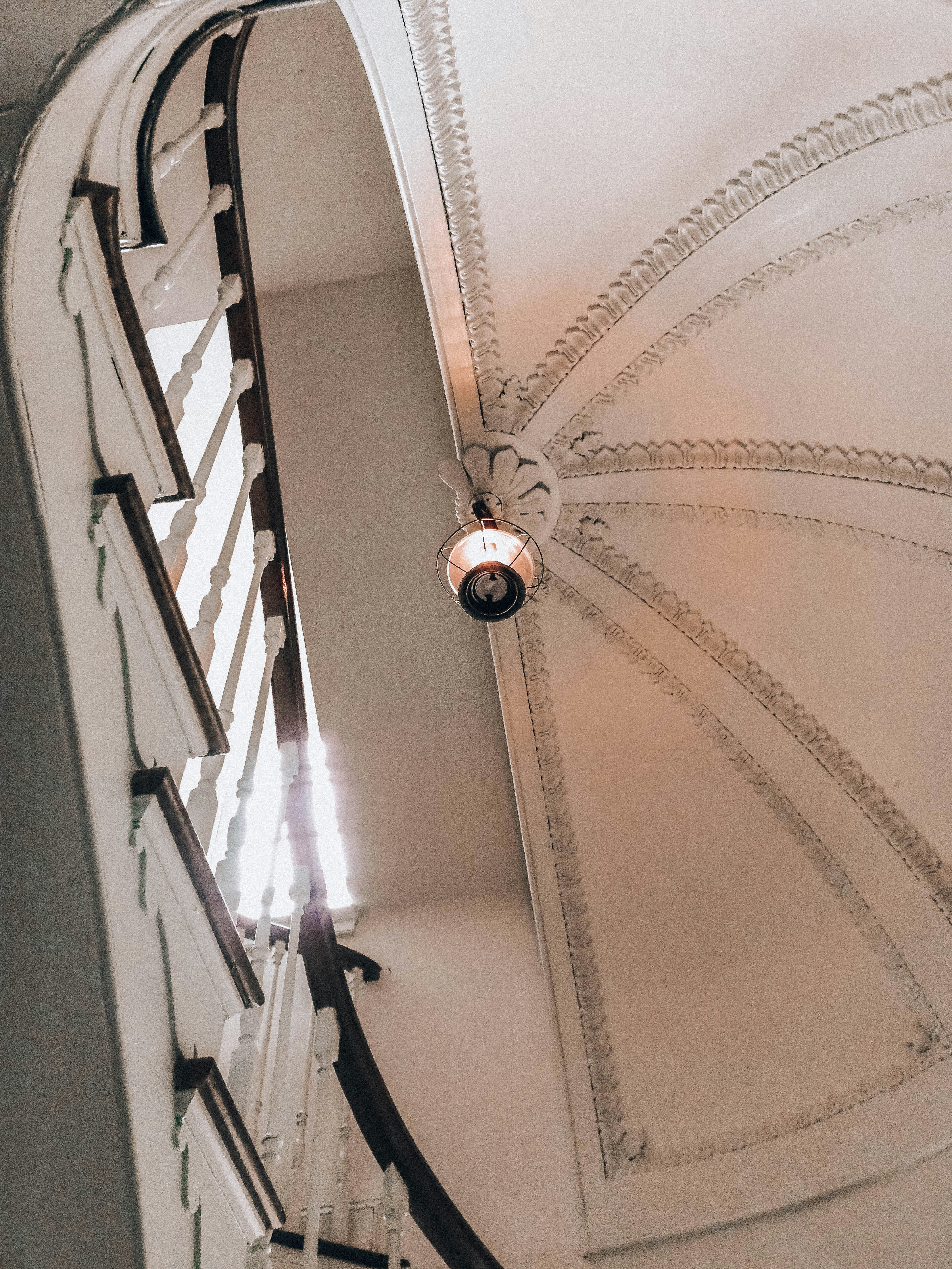 Ceiling Fresco meets Spiral Stairwell: An Architectural Moment
