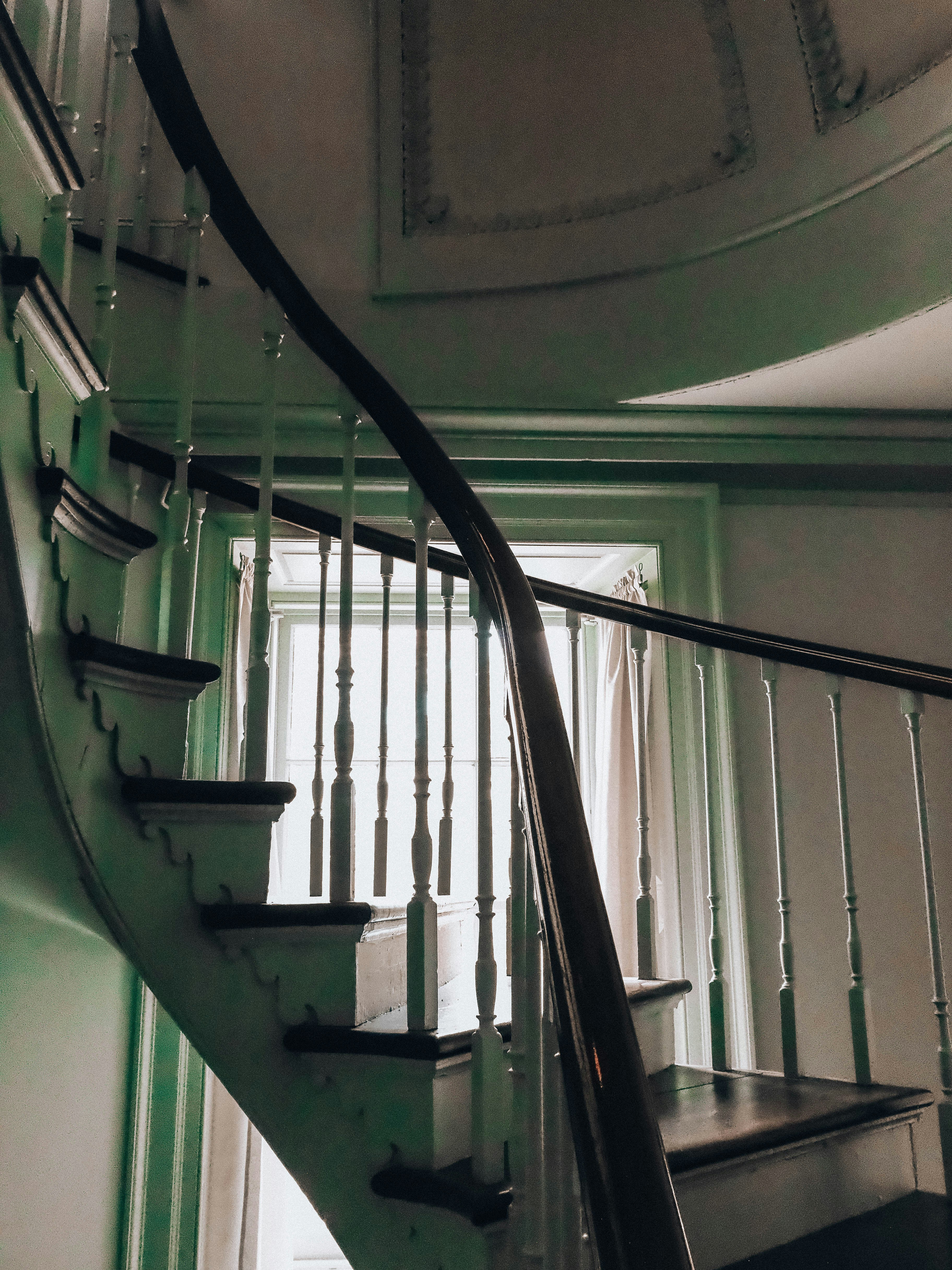 Spiral Staircase in Muted Mint Hallway